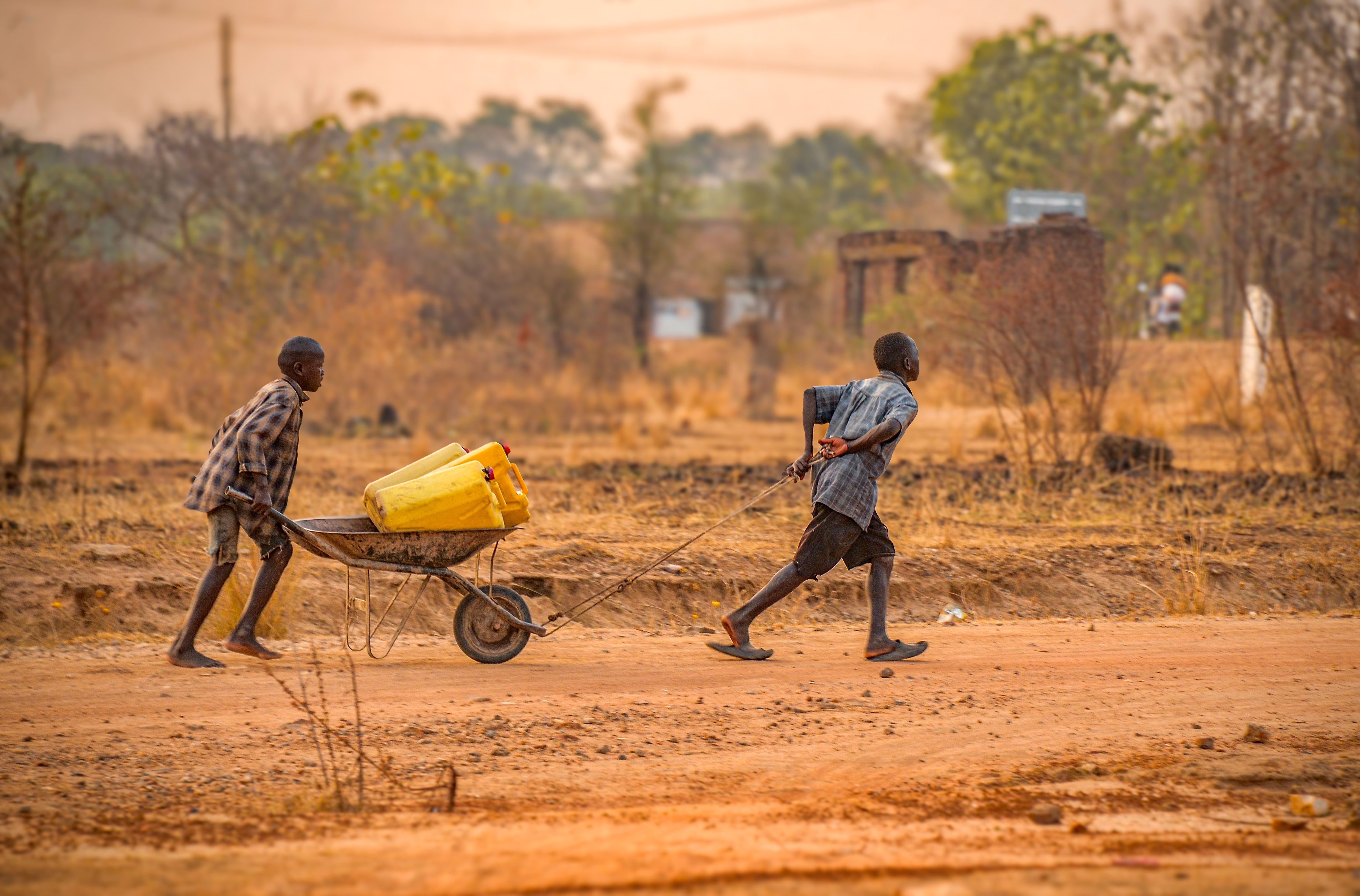 Children Transporting Water in Rural Uganda · Free Stock Photo
