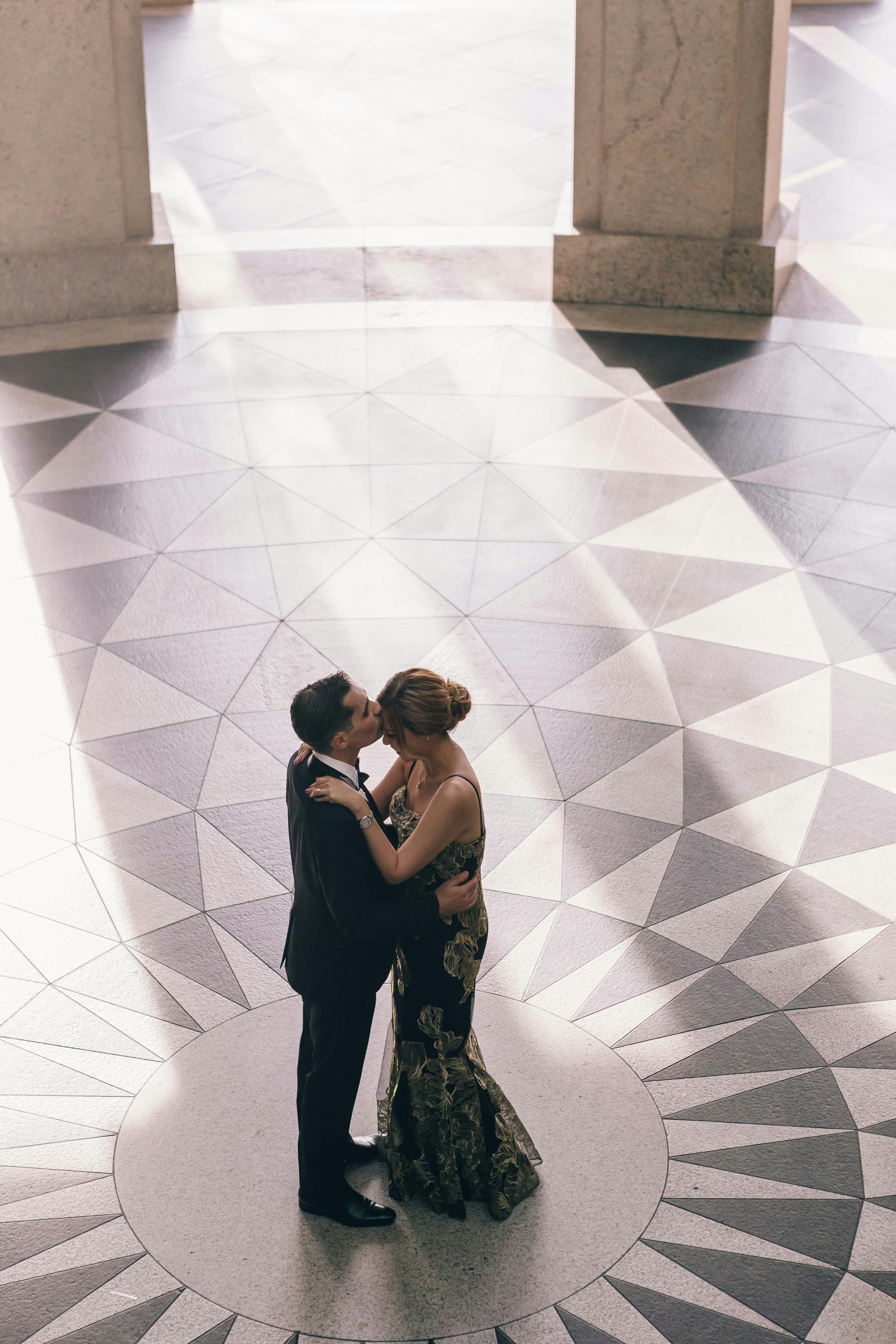Couple in Building Embracing Each other · Free Stock Photo