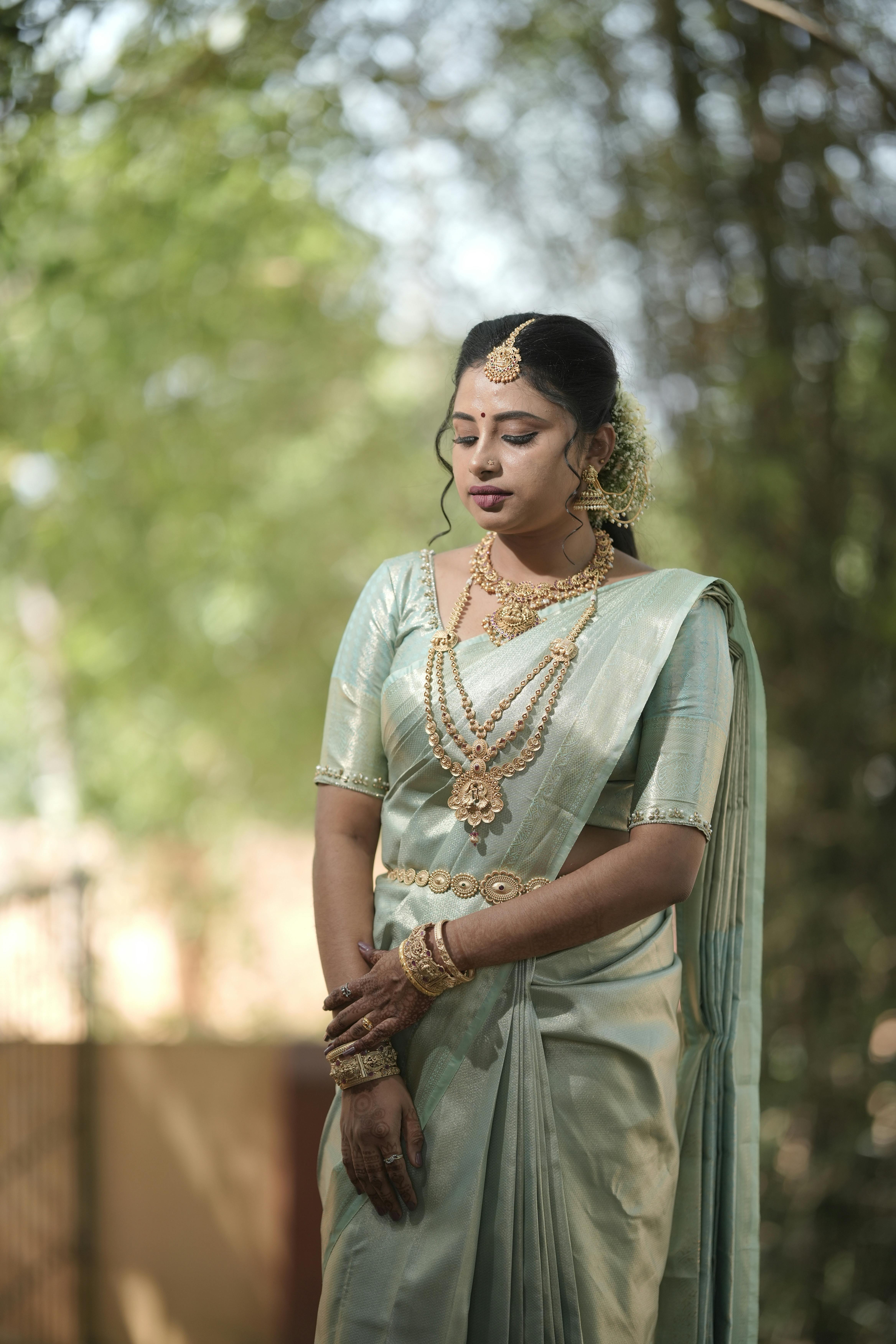 Elegant Indian Woman in Traditional Pista Green Saree · Free Stock Photo