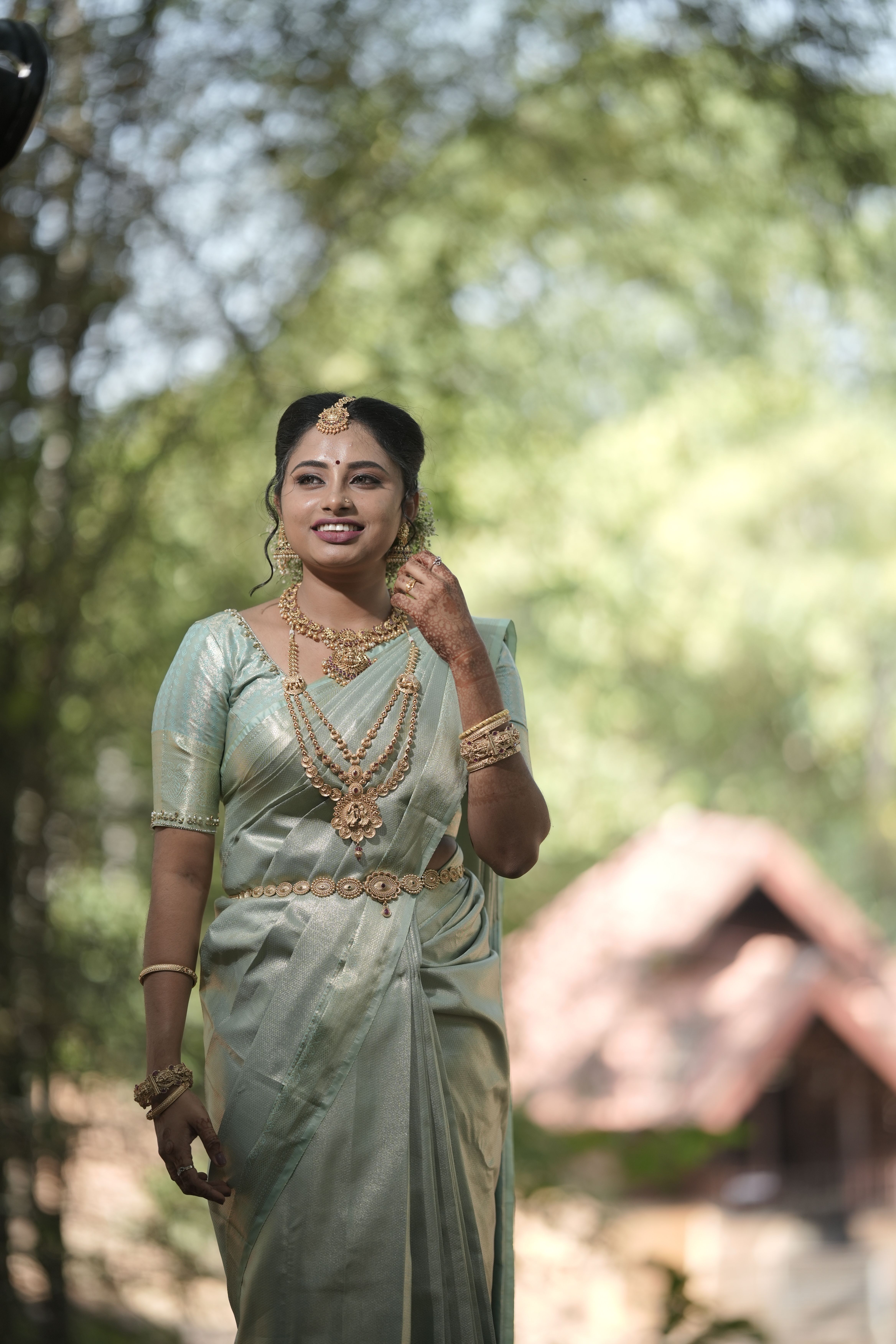 Elegant South Indian Woman in Traditional Saree Outdoors · Free Stock Photo