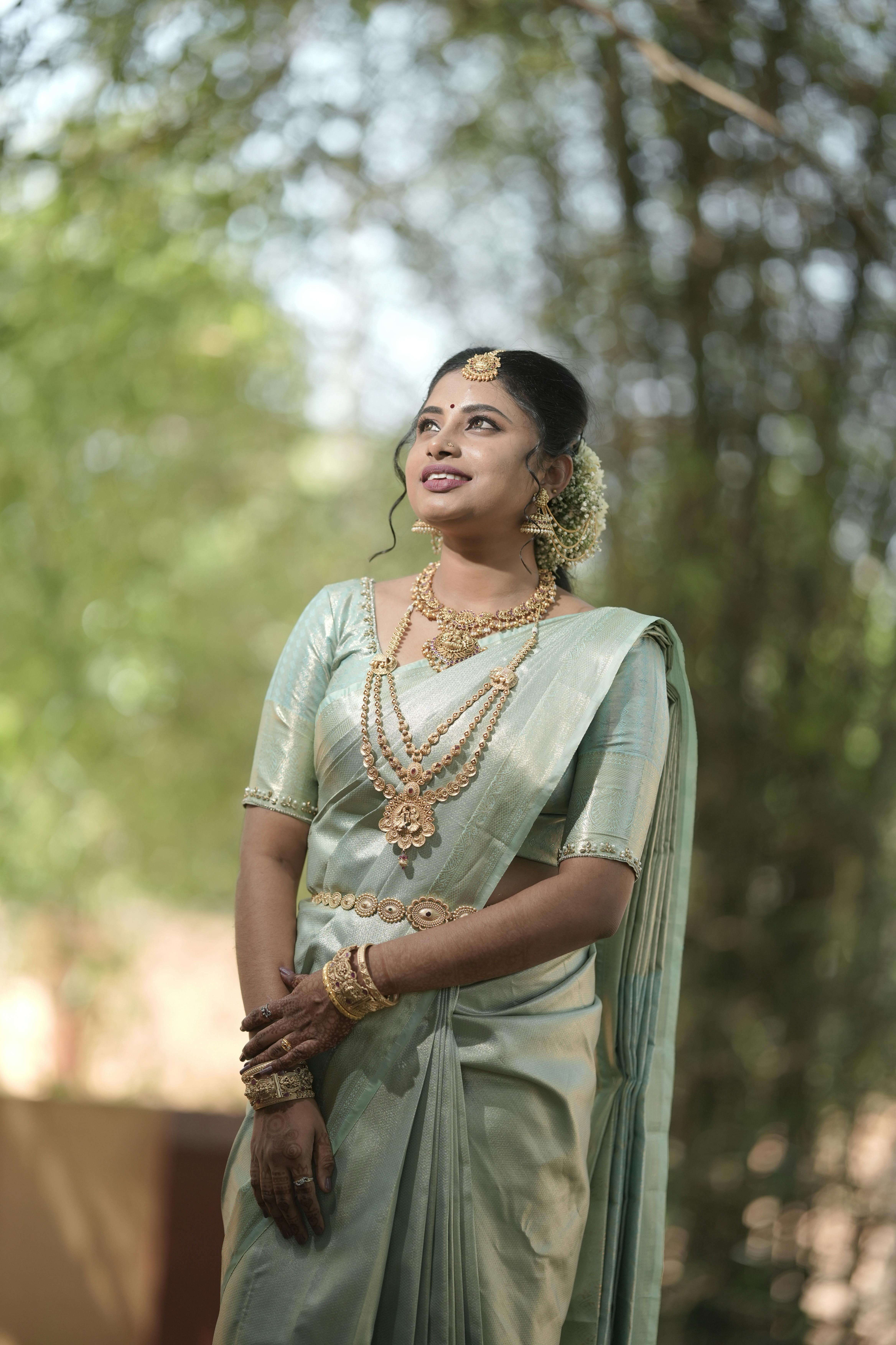 Elegant Indian Woman in Traditional Saree Outdoors · Free Stock Photo
