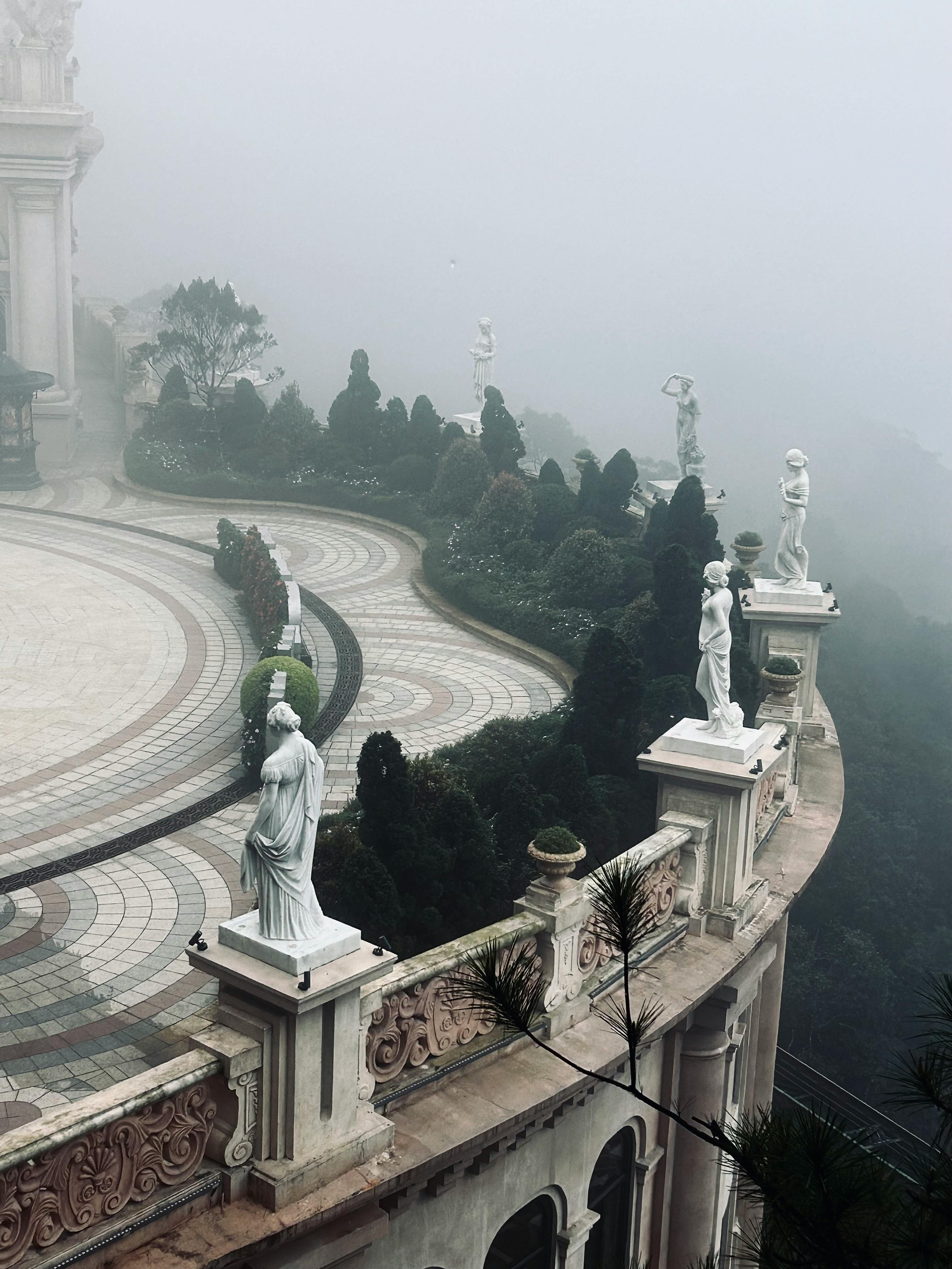 Majestic Marble Terrace in Misty Mountain Setting · Free Stock Photo