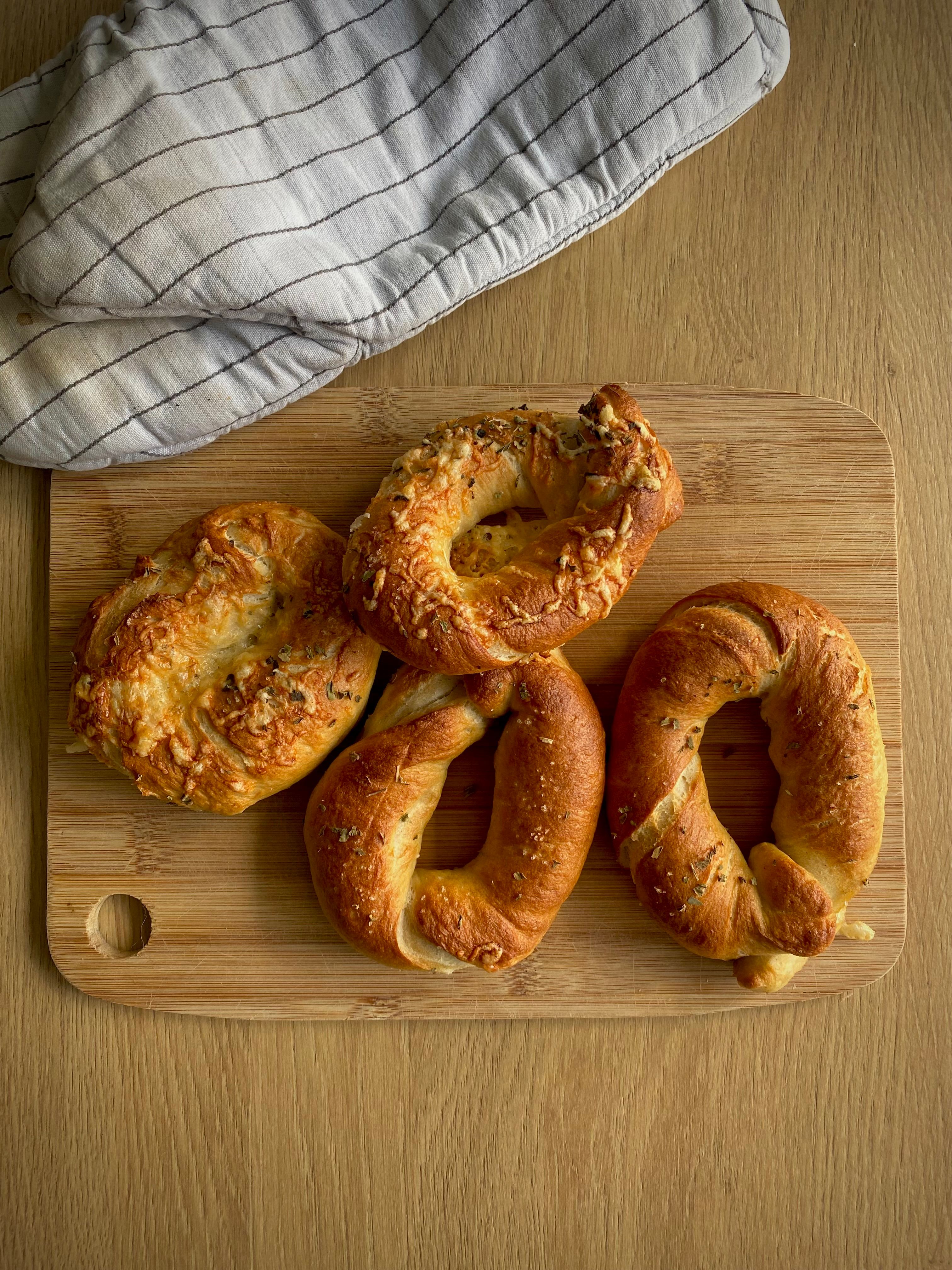 Assortment of Freshly Baked Bagels on Board · Free Stock Photo