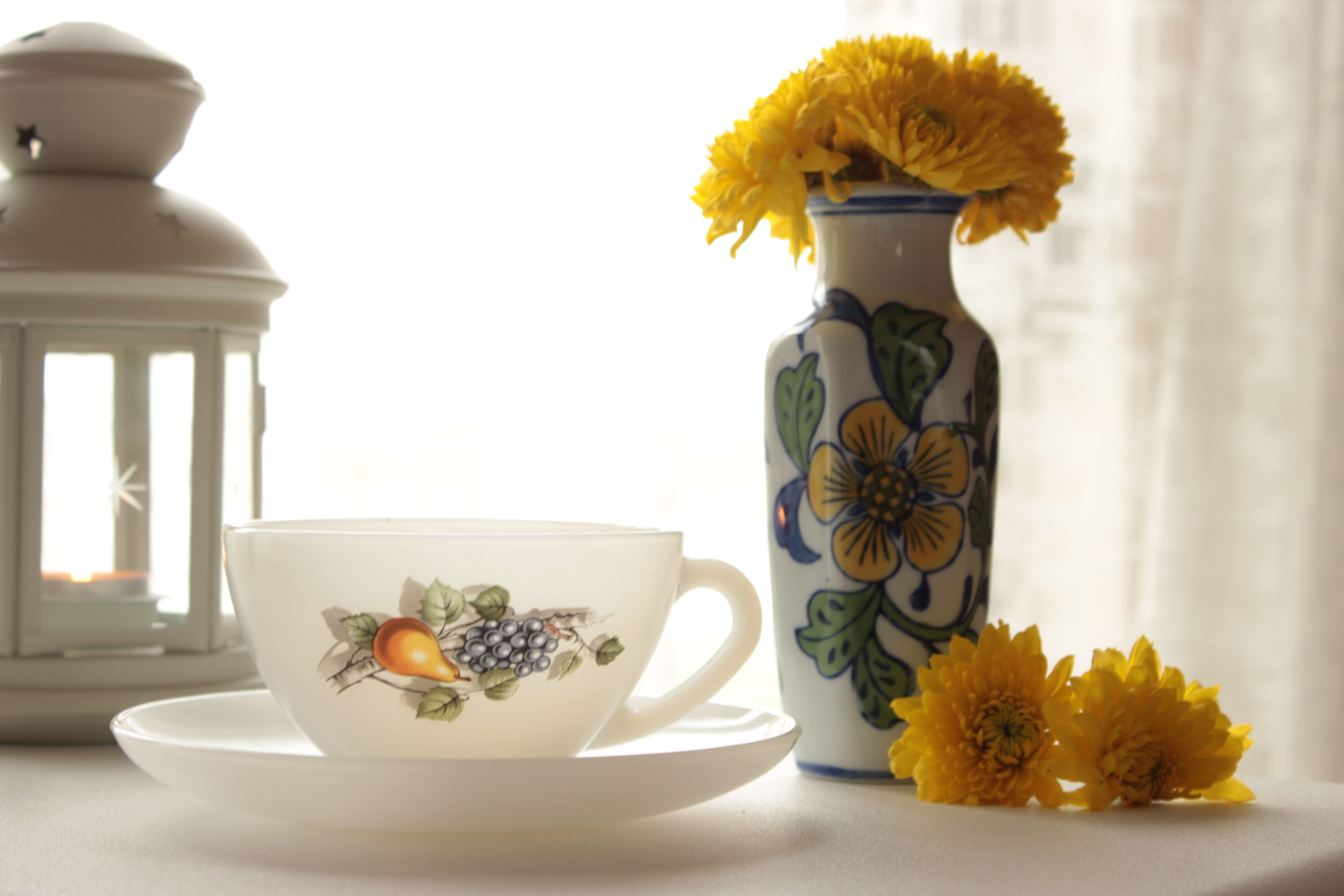 Elegant Tea Setup with Floral Vase and Lantern · Free Stock Photo