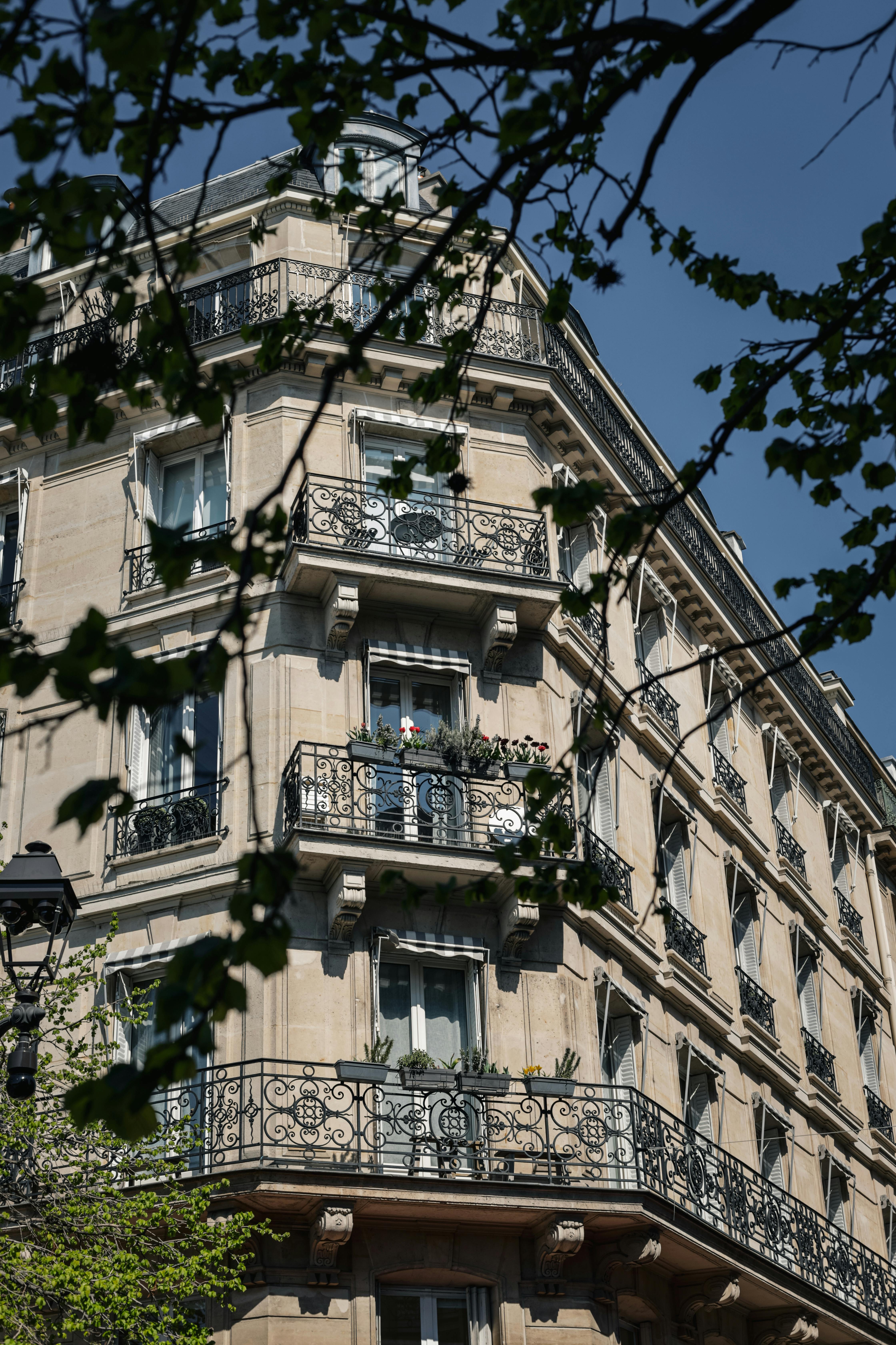 Classic Parisian Architecture with Ironwork Balconies · Free Stock Photo