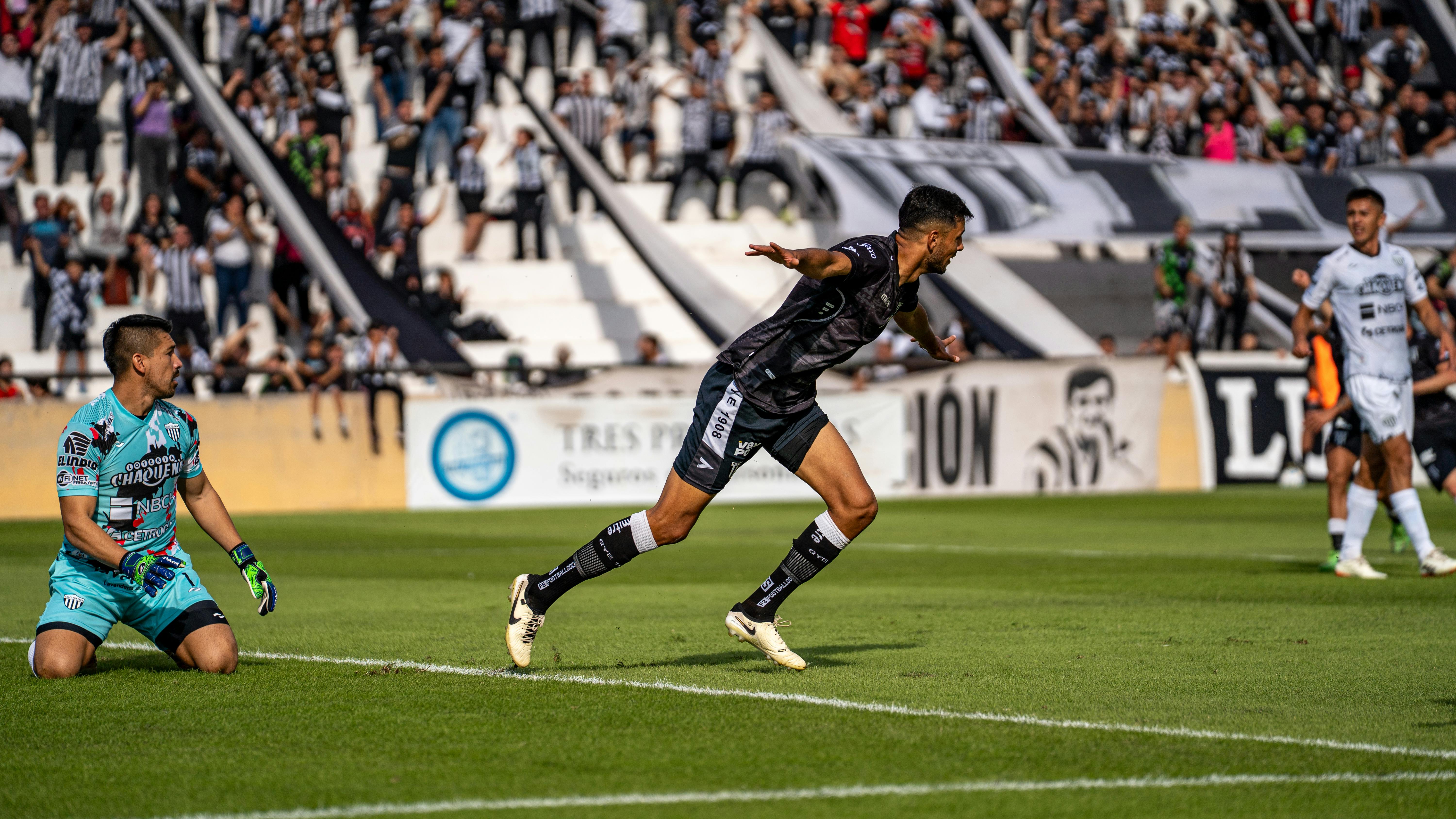 Soccer Player Celebrating Goal in Action-Packed Match · Free Stock Photo