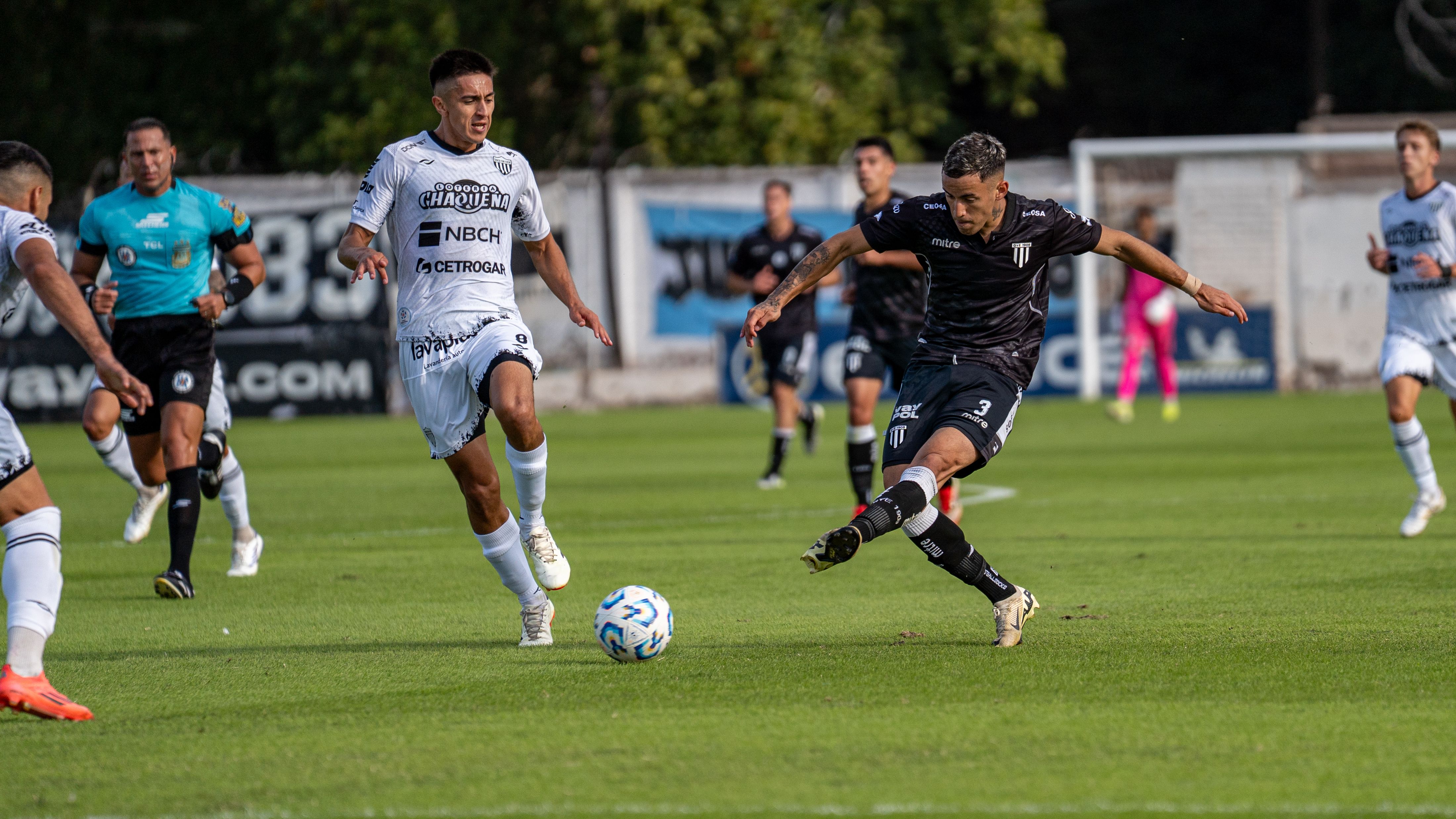 Intense Soccer Match Action on Vibrant Field · Free Stock Photo
