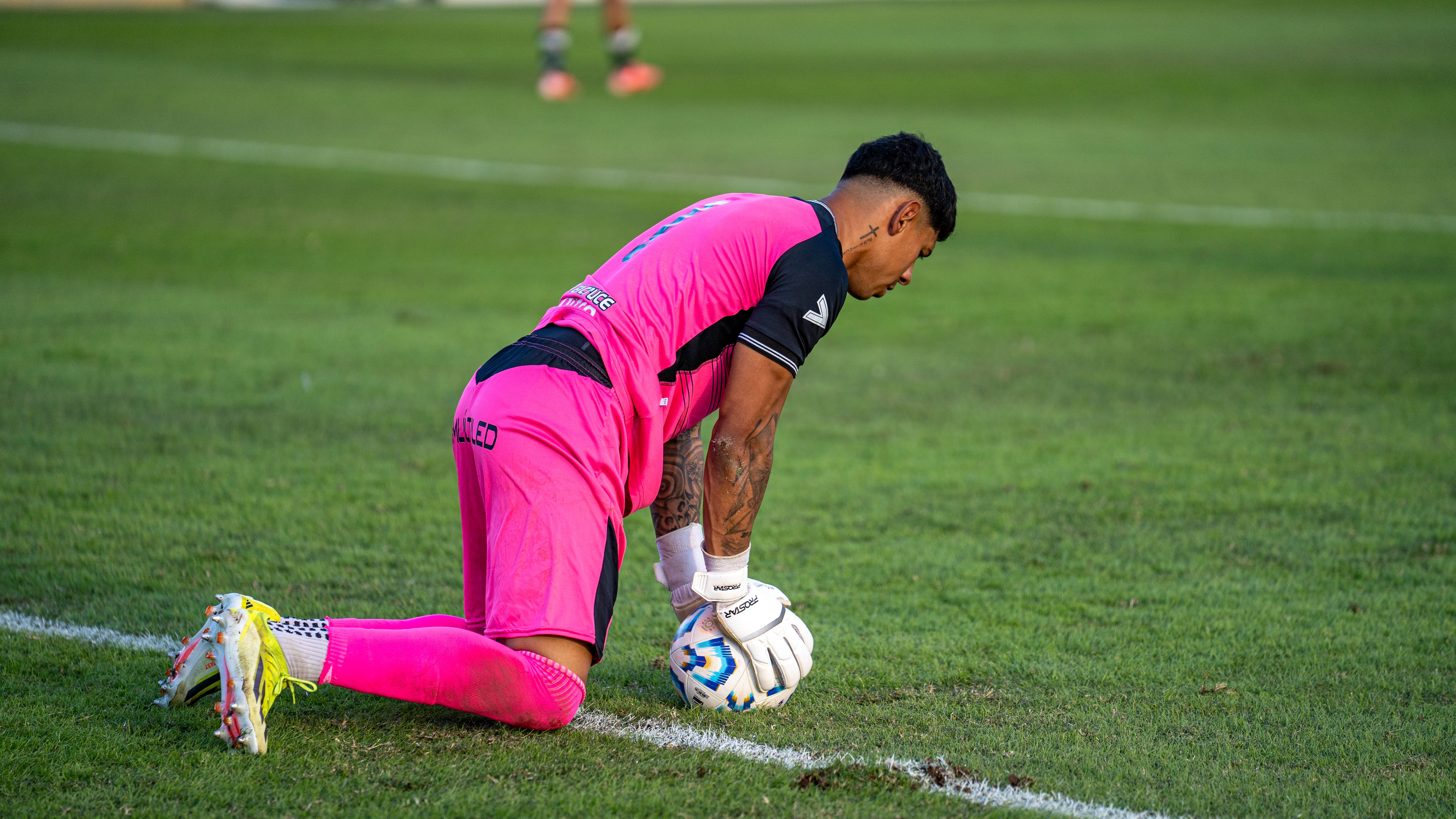 Soccer Goalkeeper in Pink Uniform on Field · Free Stock Photo