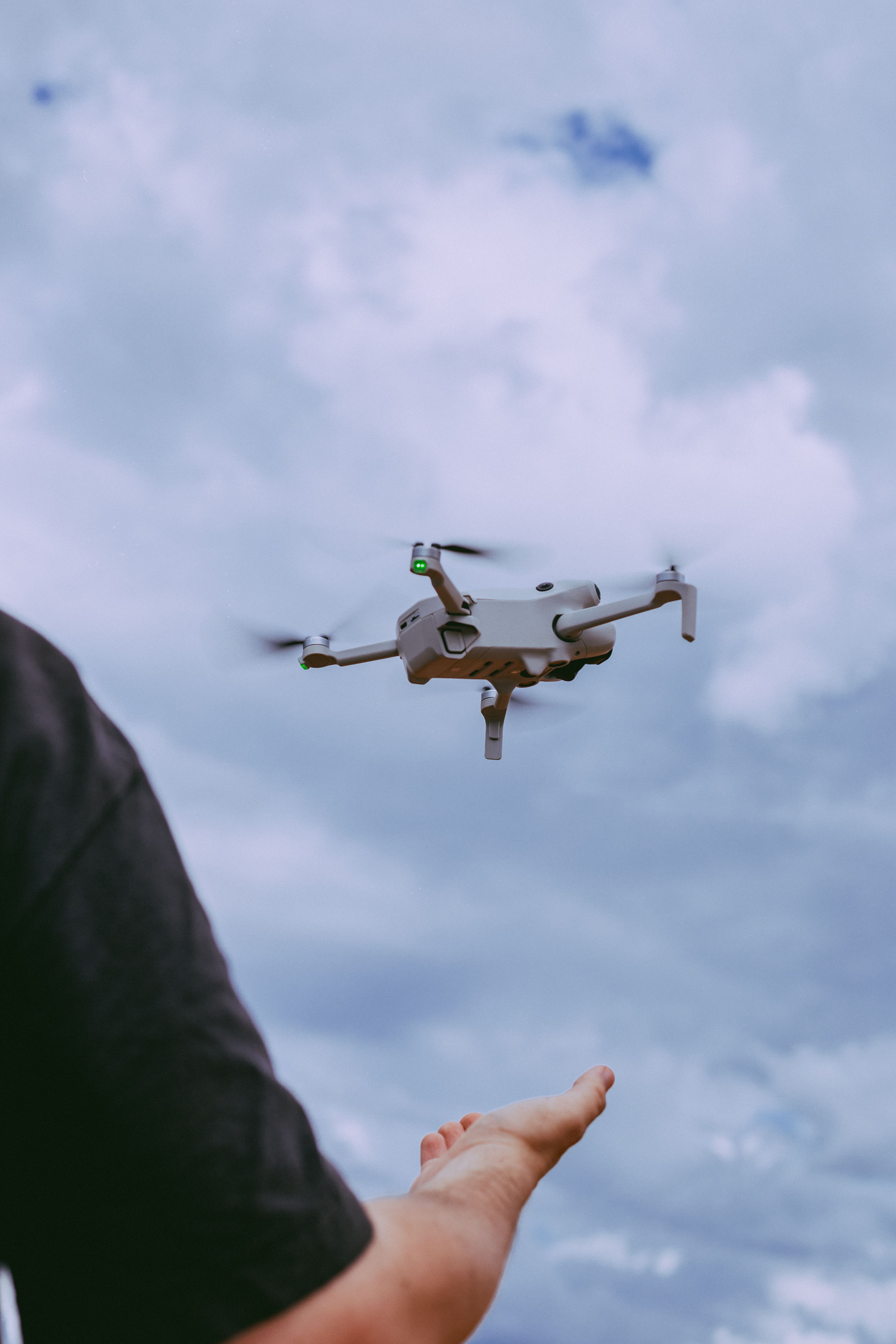 Man Holding Drone Remote Standing on Gray Concrete Pavement · Free ...
