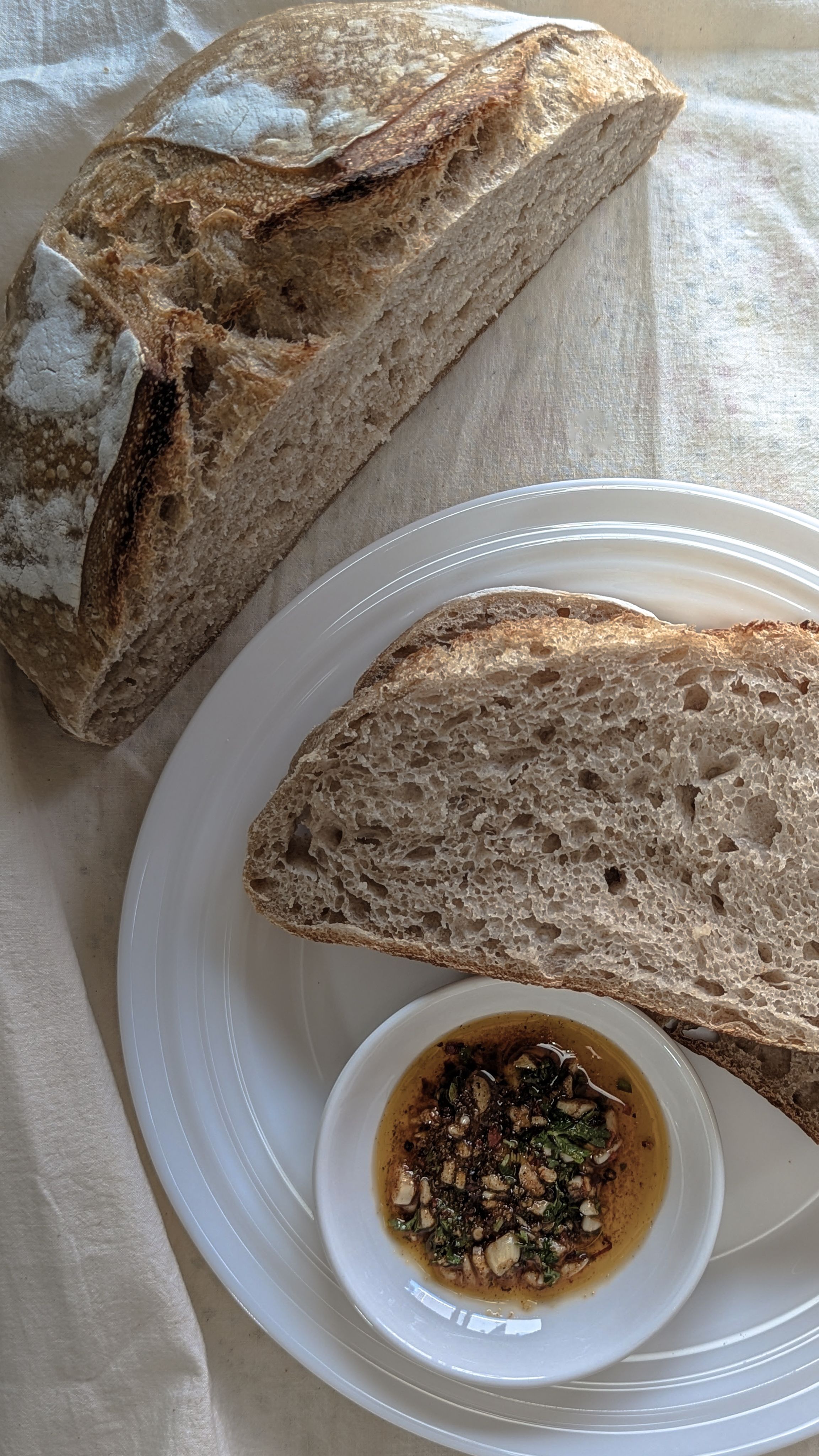 Rustic Sourdough Bread with Herb Oil Dip · Free Stock Photo