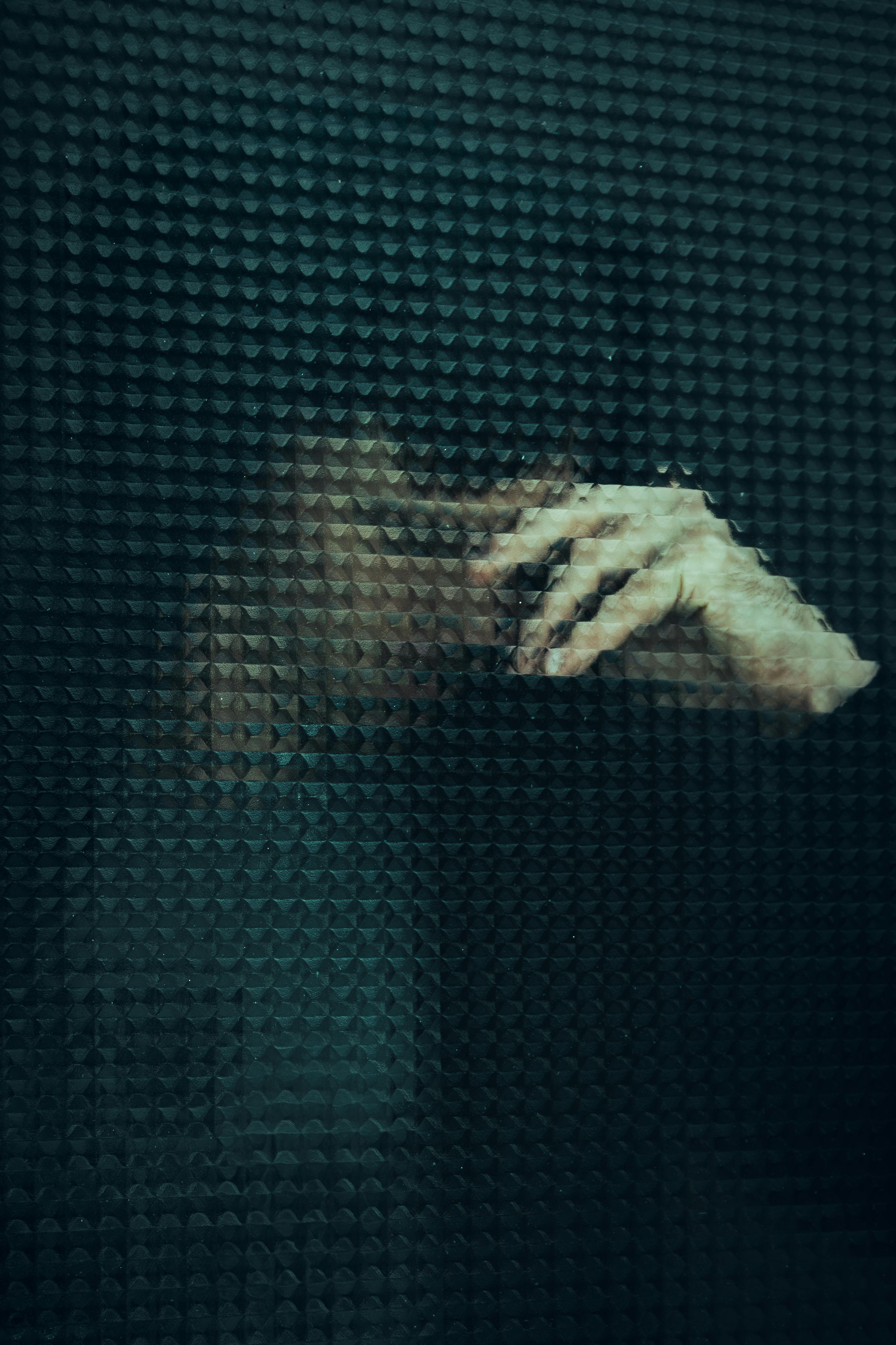 Moody Artistic Portrait Behind Textured Glass · Free Stock Photo
