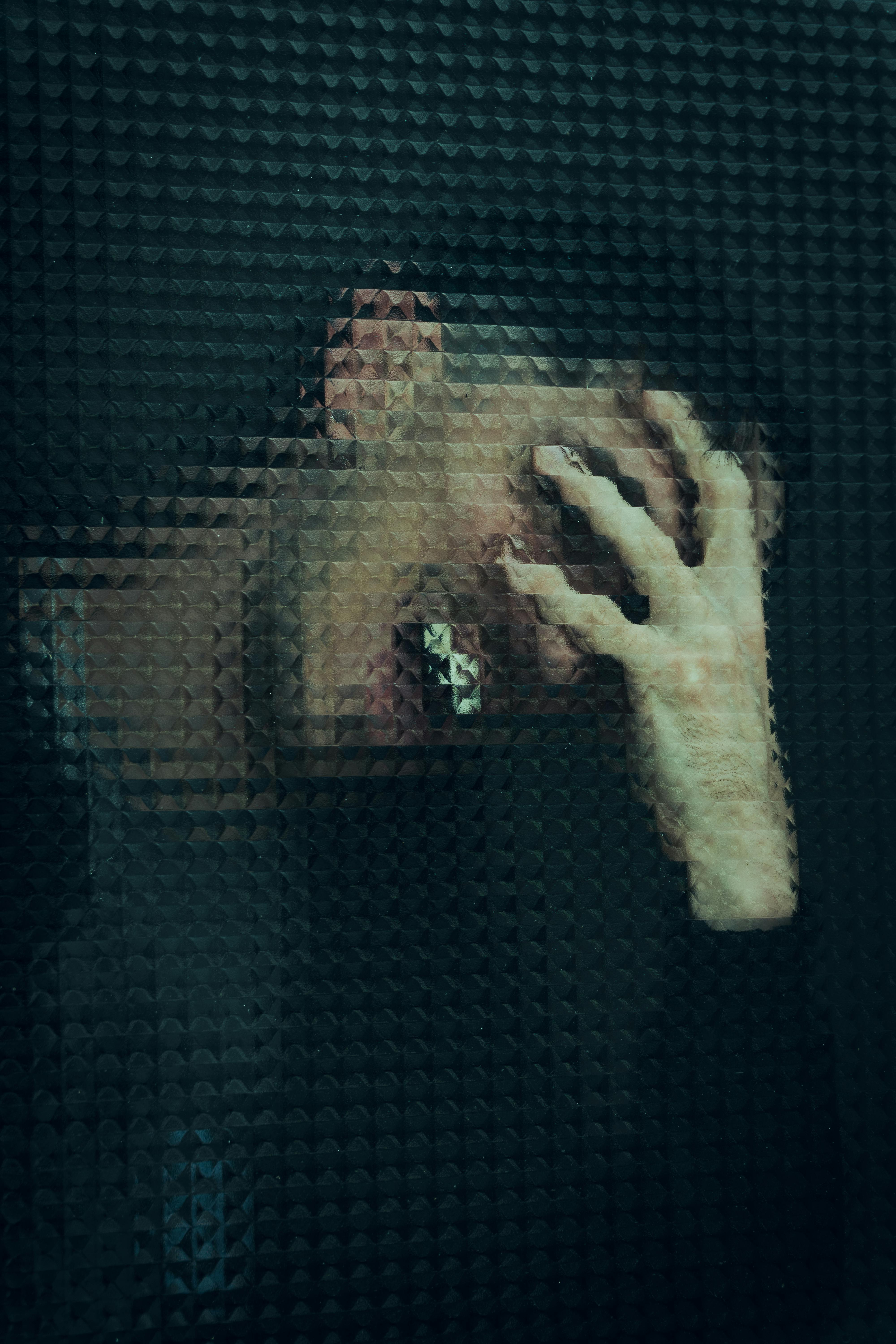 Artistic Portrait Behind Textured Glass · Free Stock Photo
