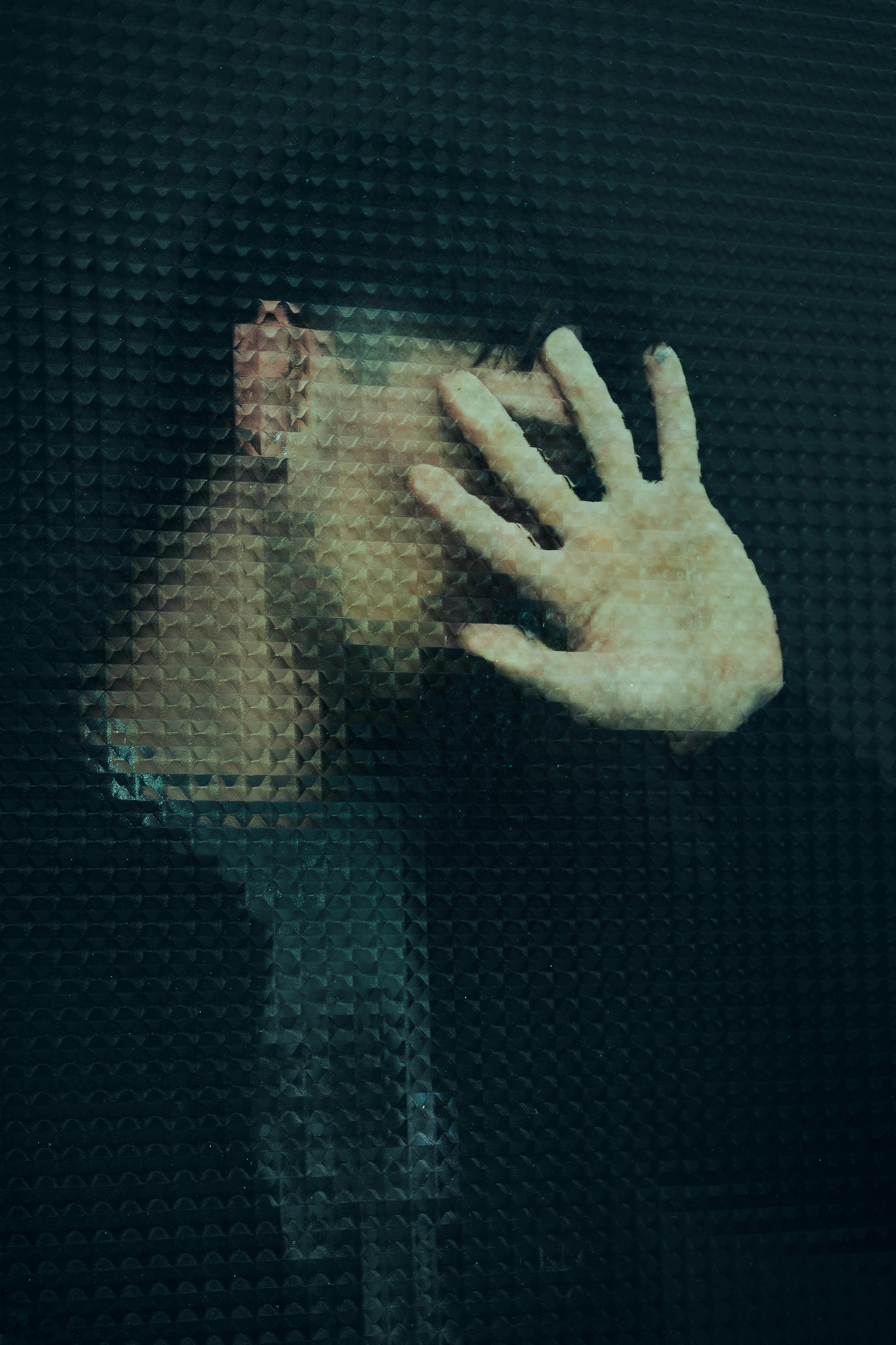 Dramatic Artistic Portrait Behind Textured Glass · Free Stock Photo