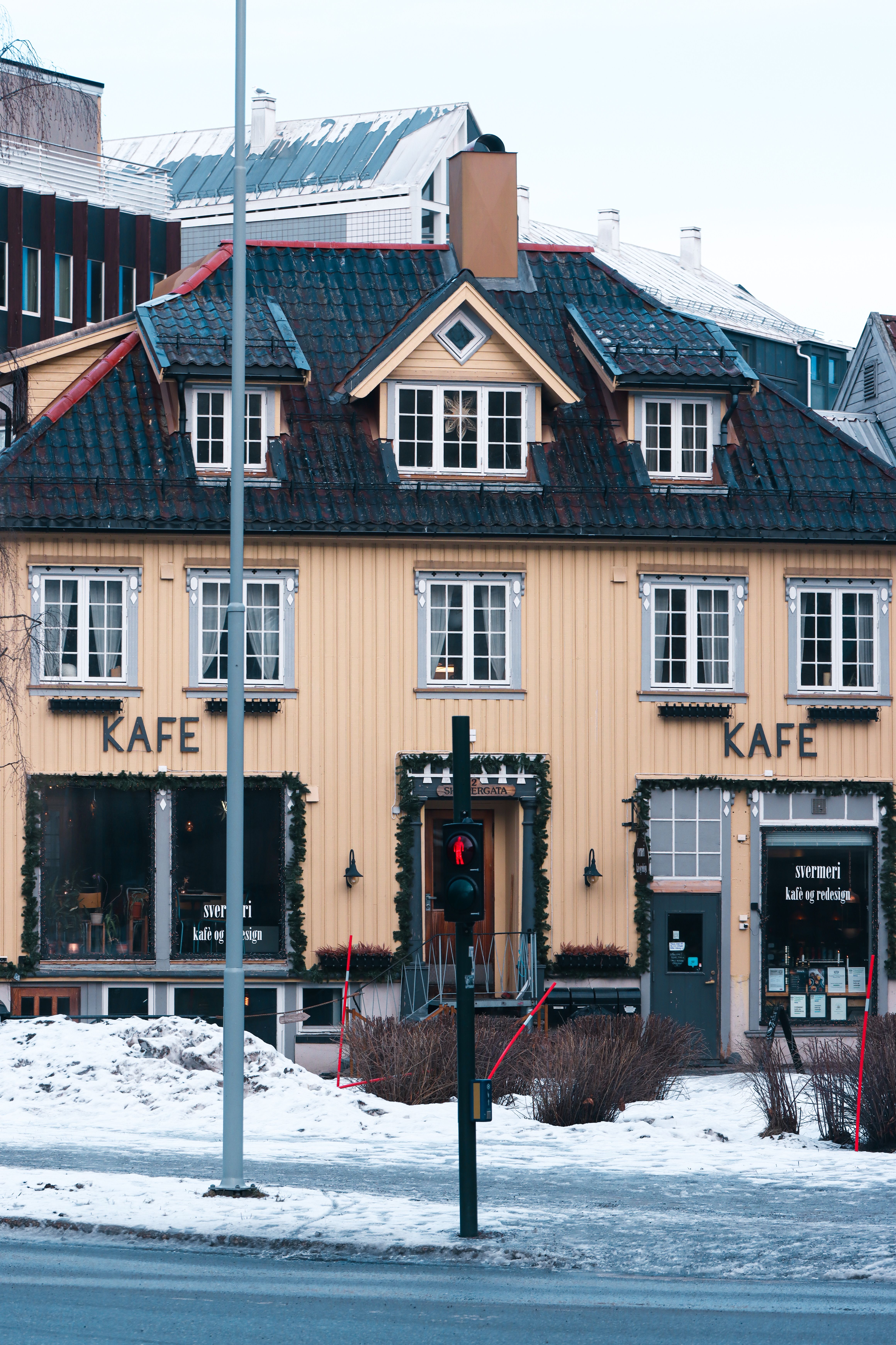 Charming Cafe in Snowy Tromsø, Norway Street Scene · Free Stock Photo