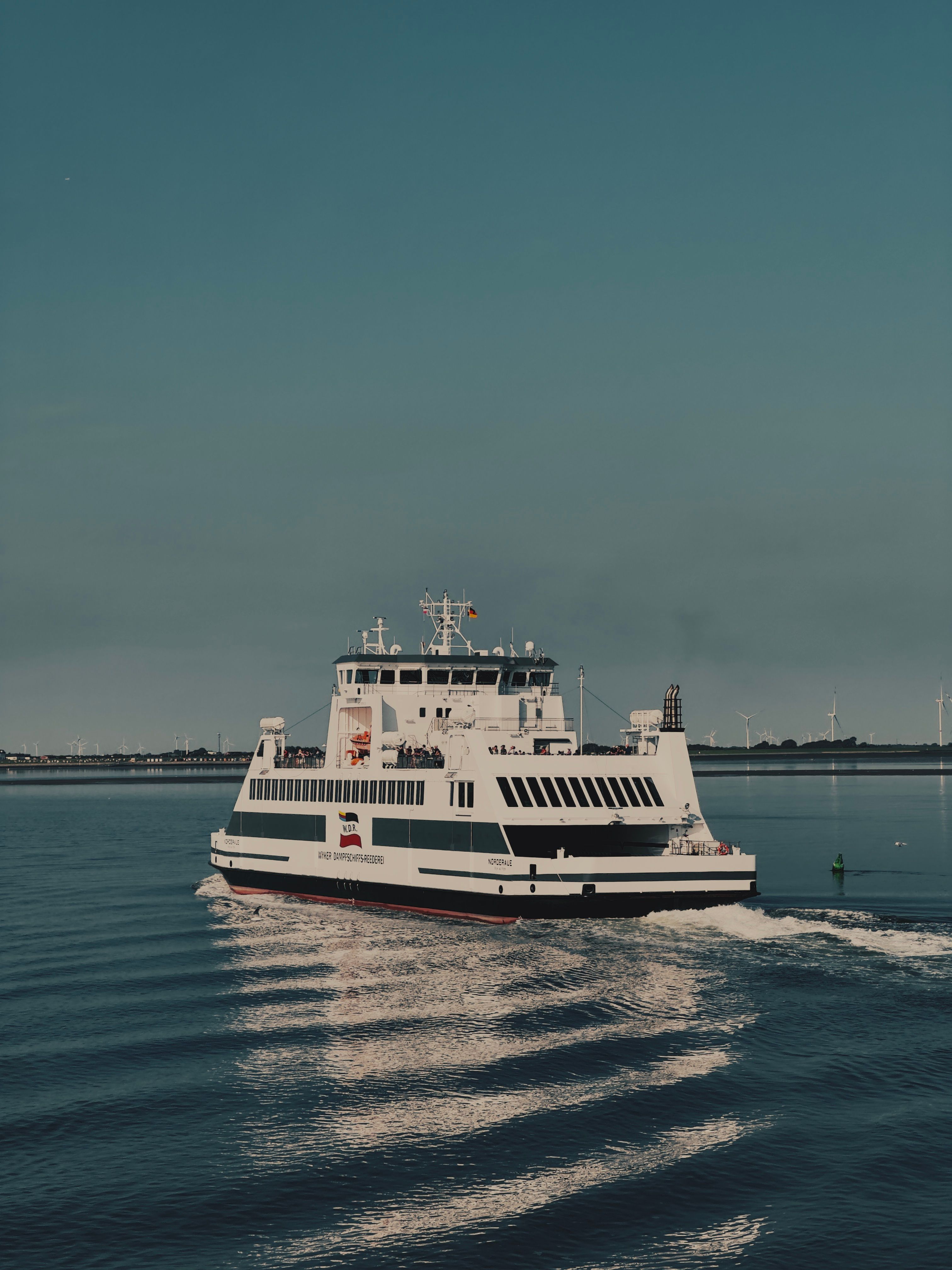 Elegant Ferry Cruising on a Calm Sea Under Clear Skies · Free Stock Photo