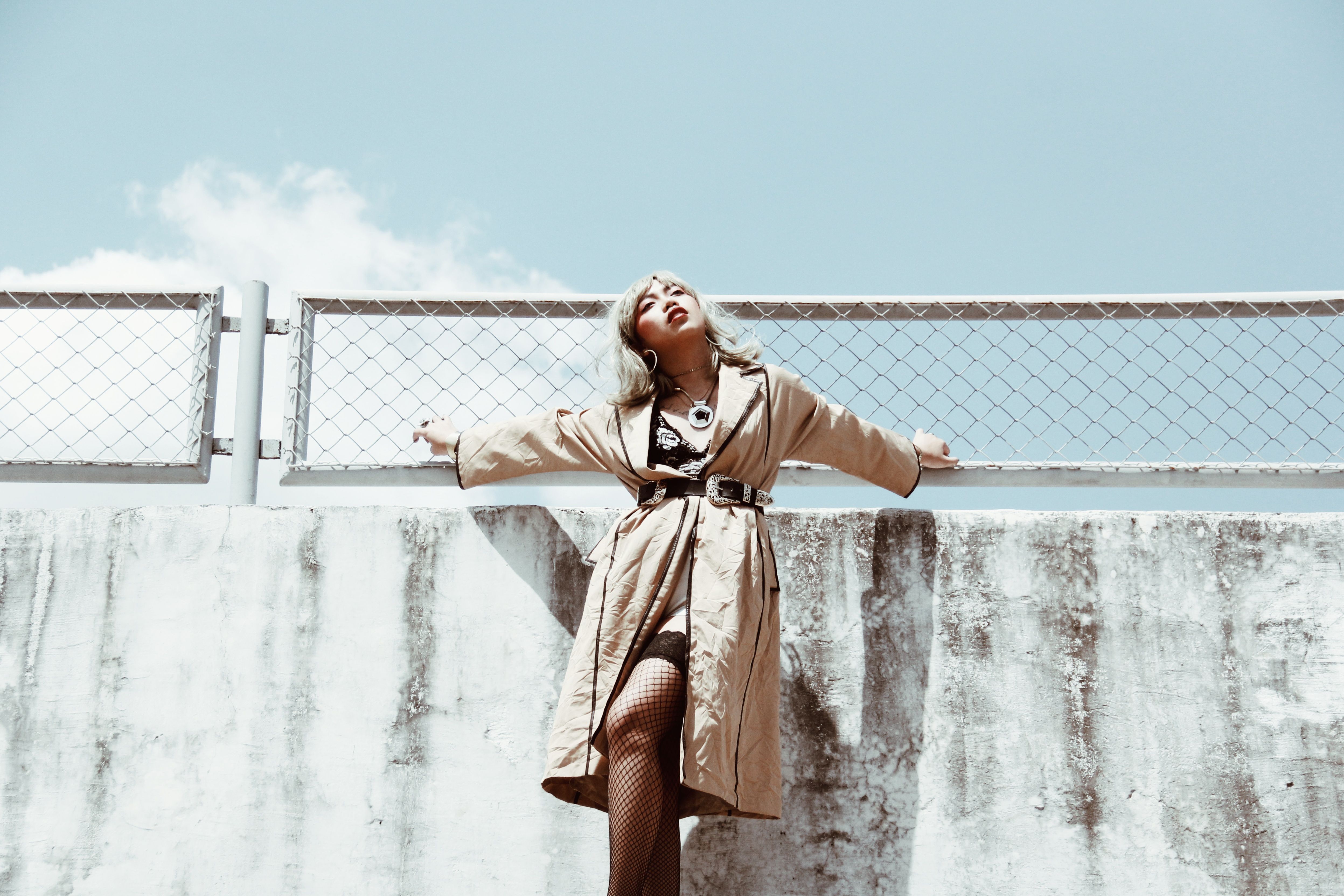 Low Angle Photo of Woman Wearing Brown Coat · Free Stock Photo
