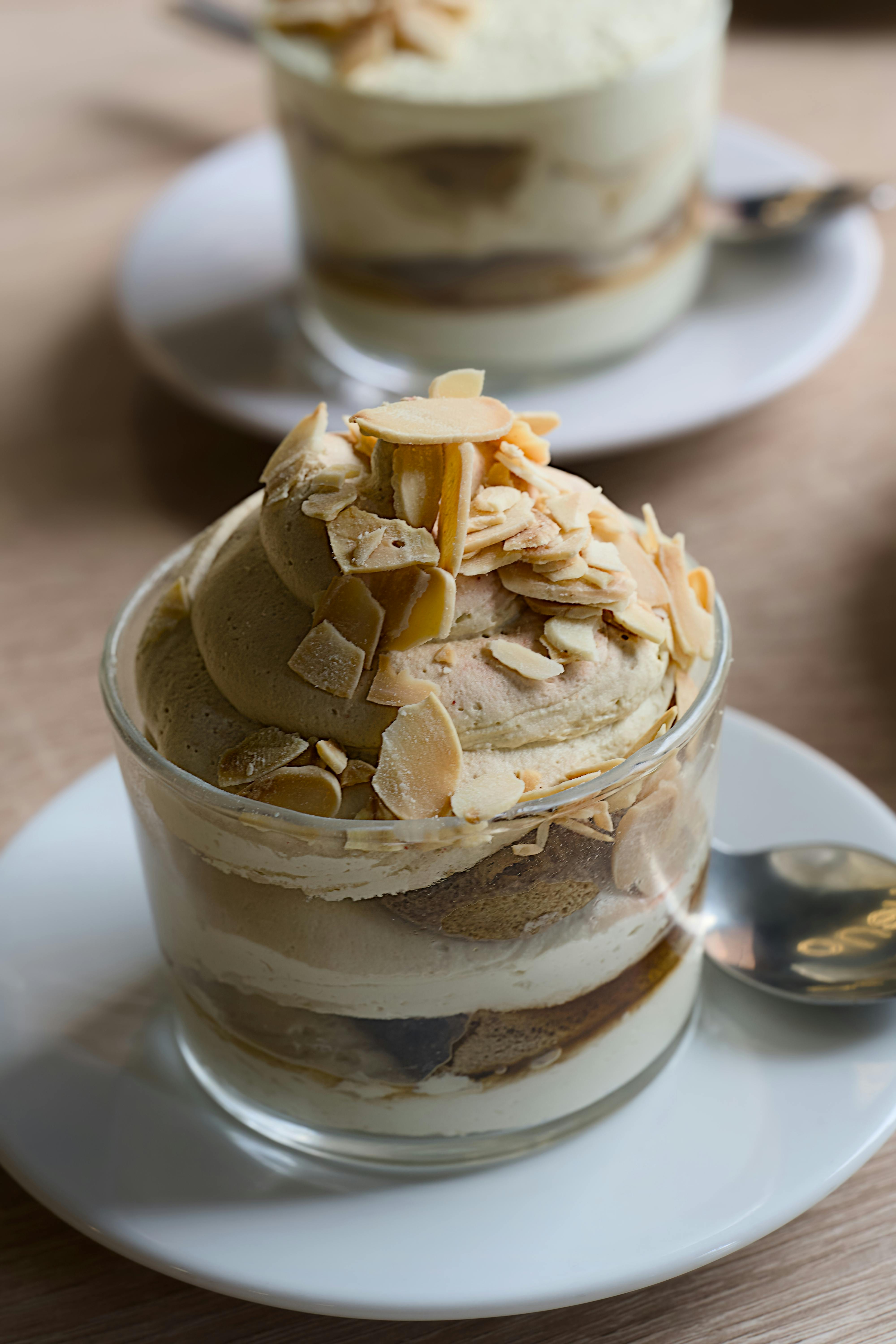Delicious Tiramisu Dessert with Almond Toppings · Free Stock Photo