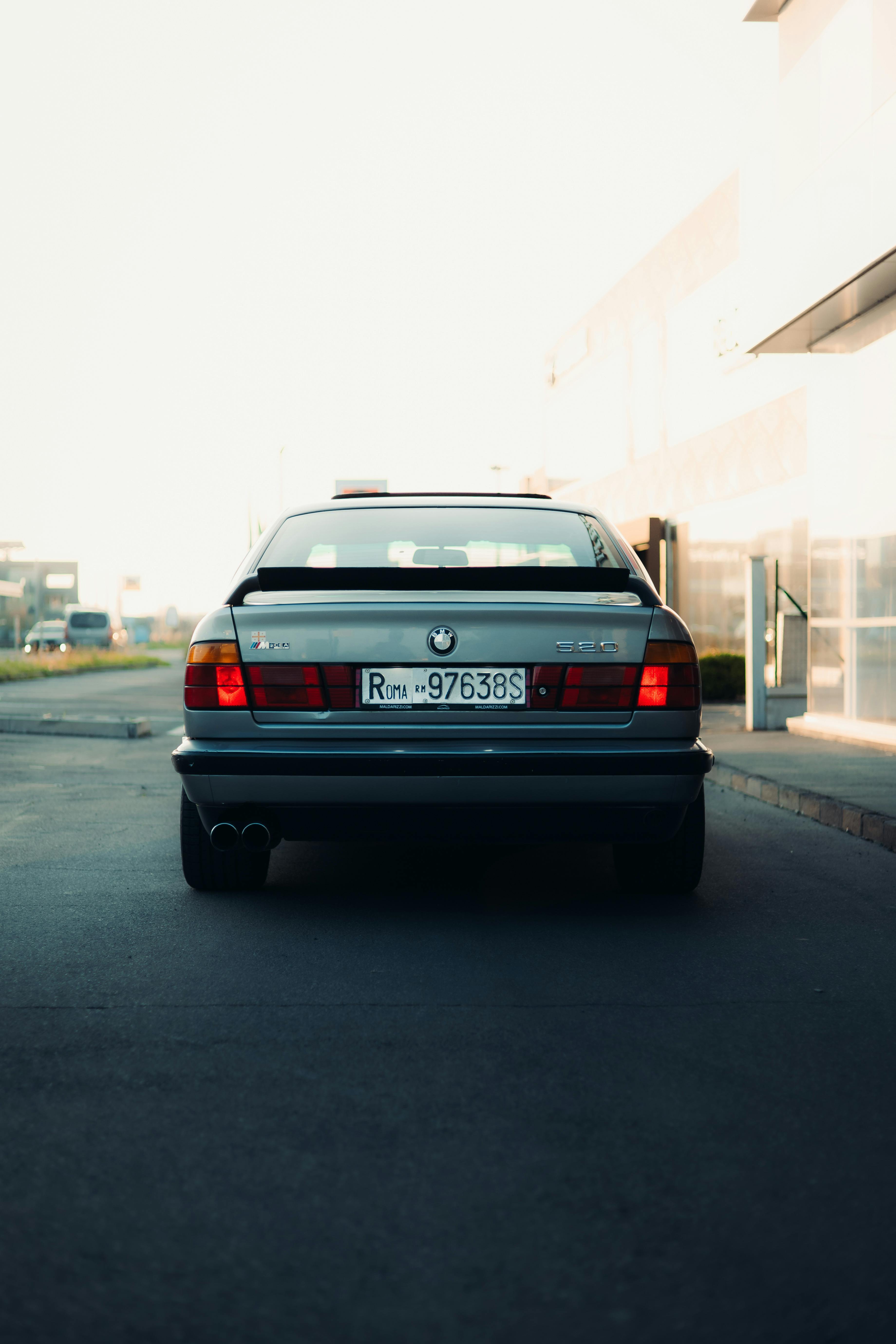 Rear View of Classic BMW Car on a City Street · Free Stock Photo
