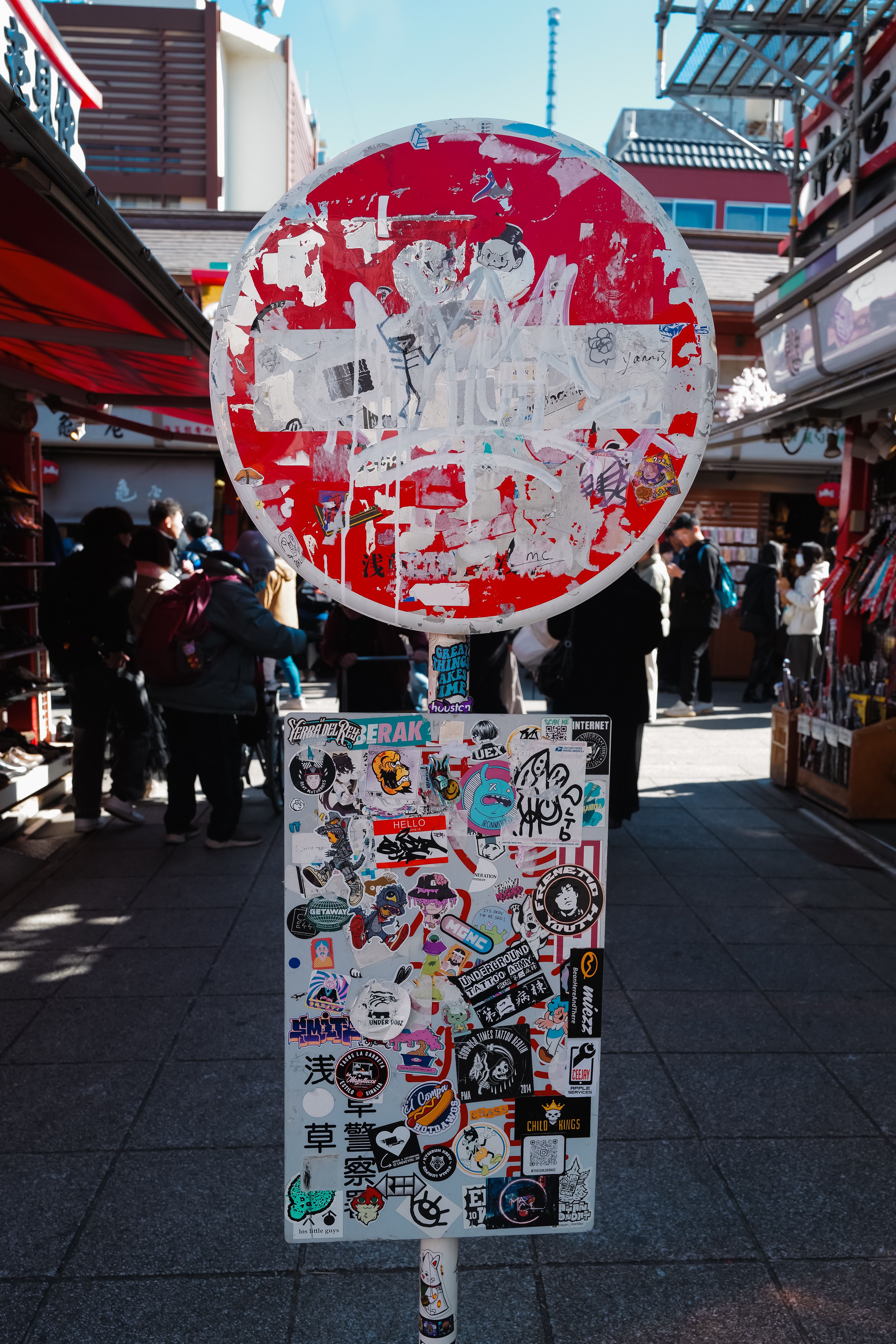 Graffiti-Covered Sign in Taito City, Tokyo Street · Free Stock Photo