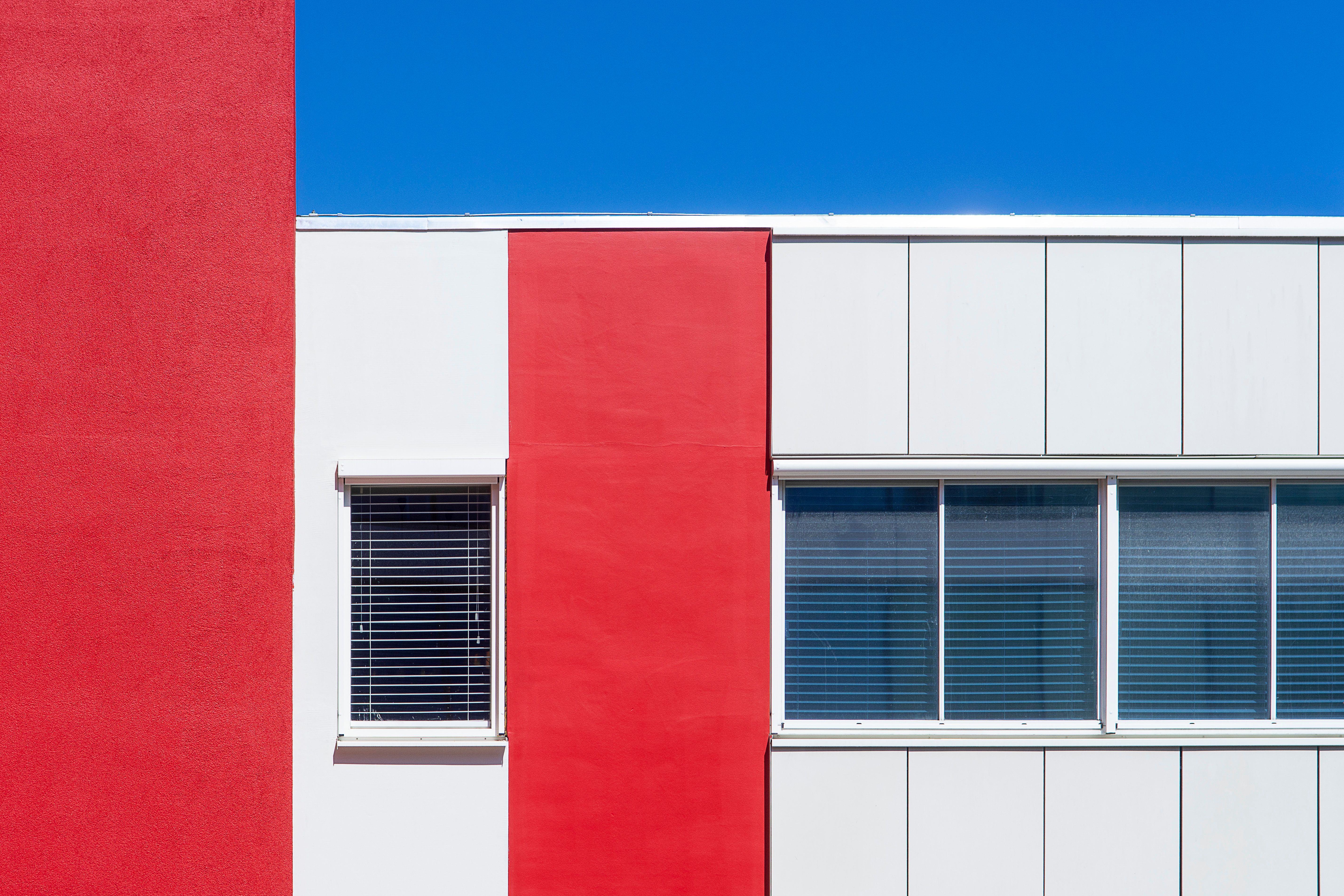 Modern Building Facade with Red and White Design · Free Stock Photo