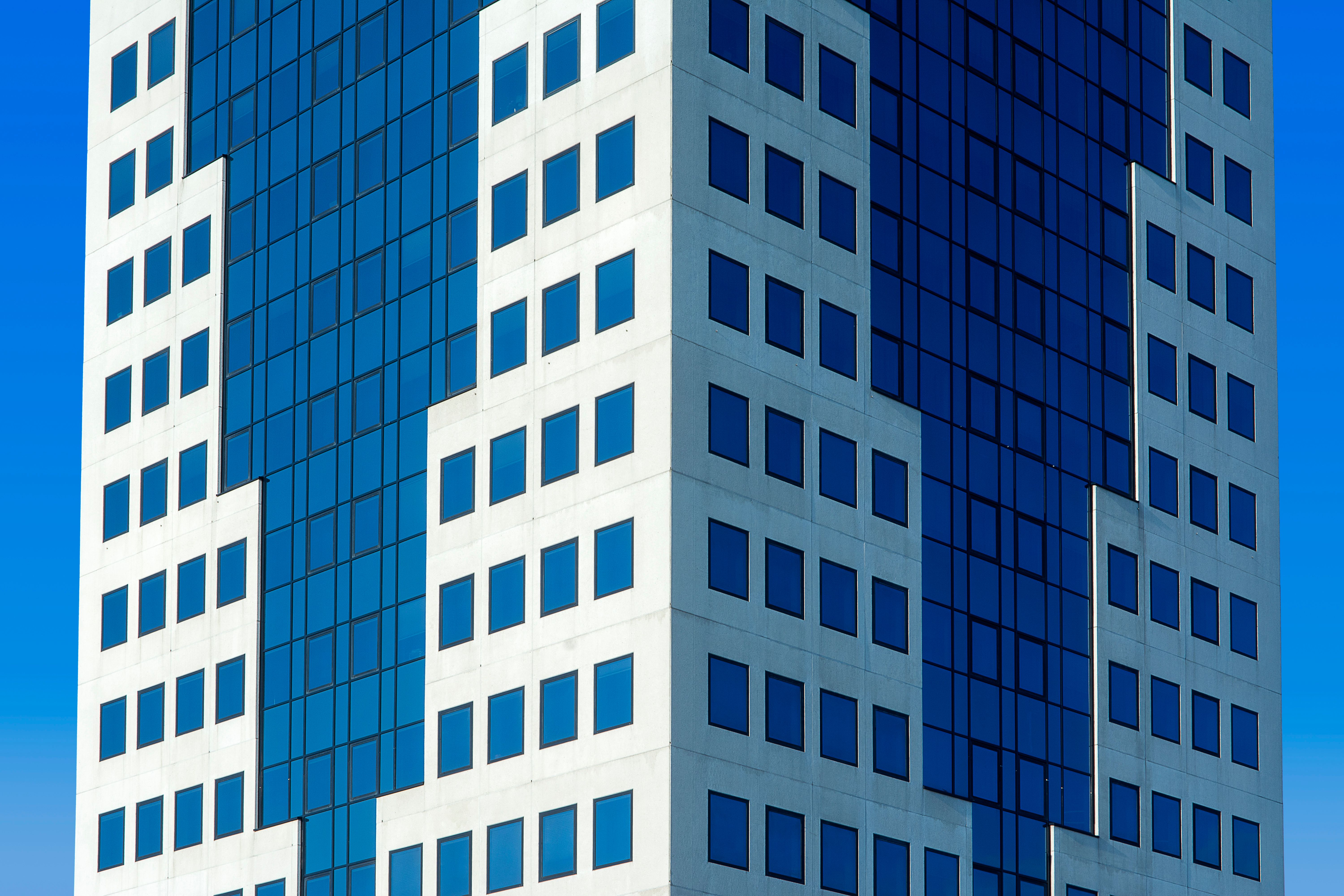 Modern Skyscraper with Blue Glass Windows · Free Stock Photo