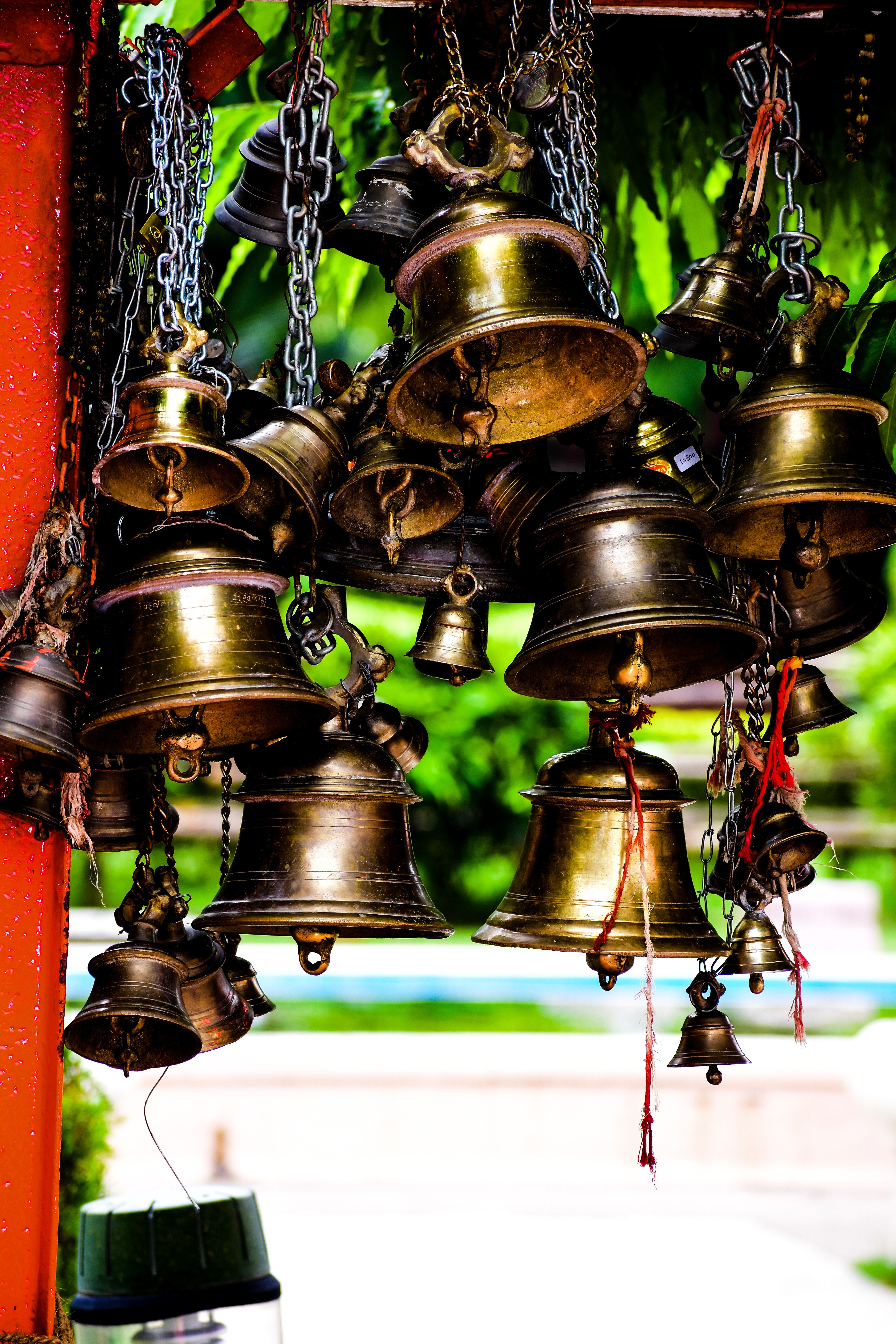 Hanging Brass Bells in Religious Setting · Free Stock Photo