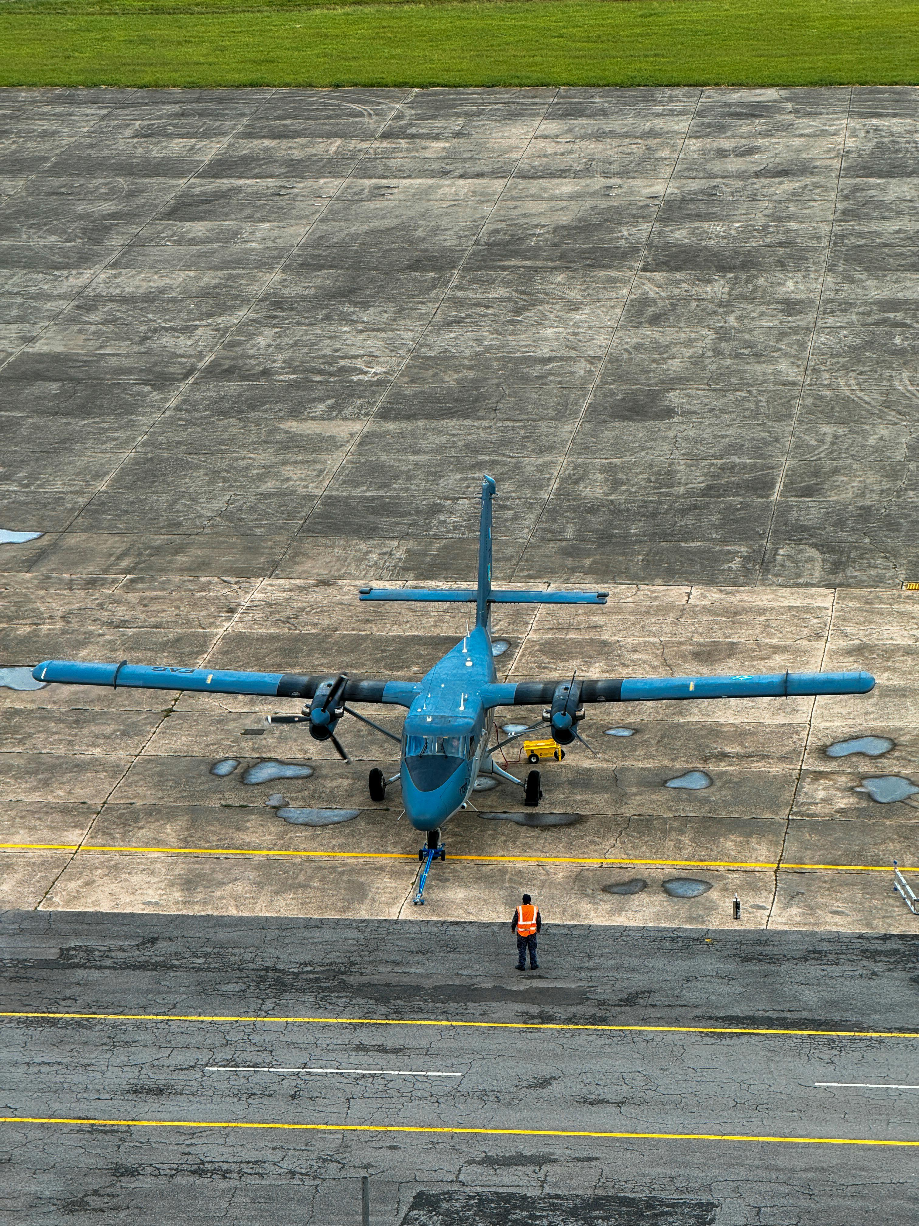 Aerial View of Small Blue Airplane at Airport · Free Stock Photo