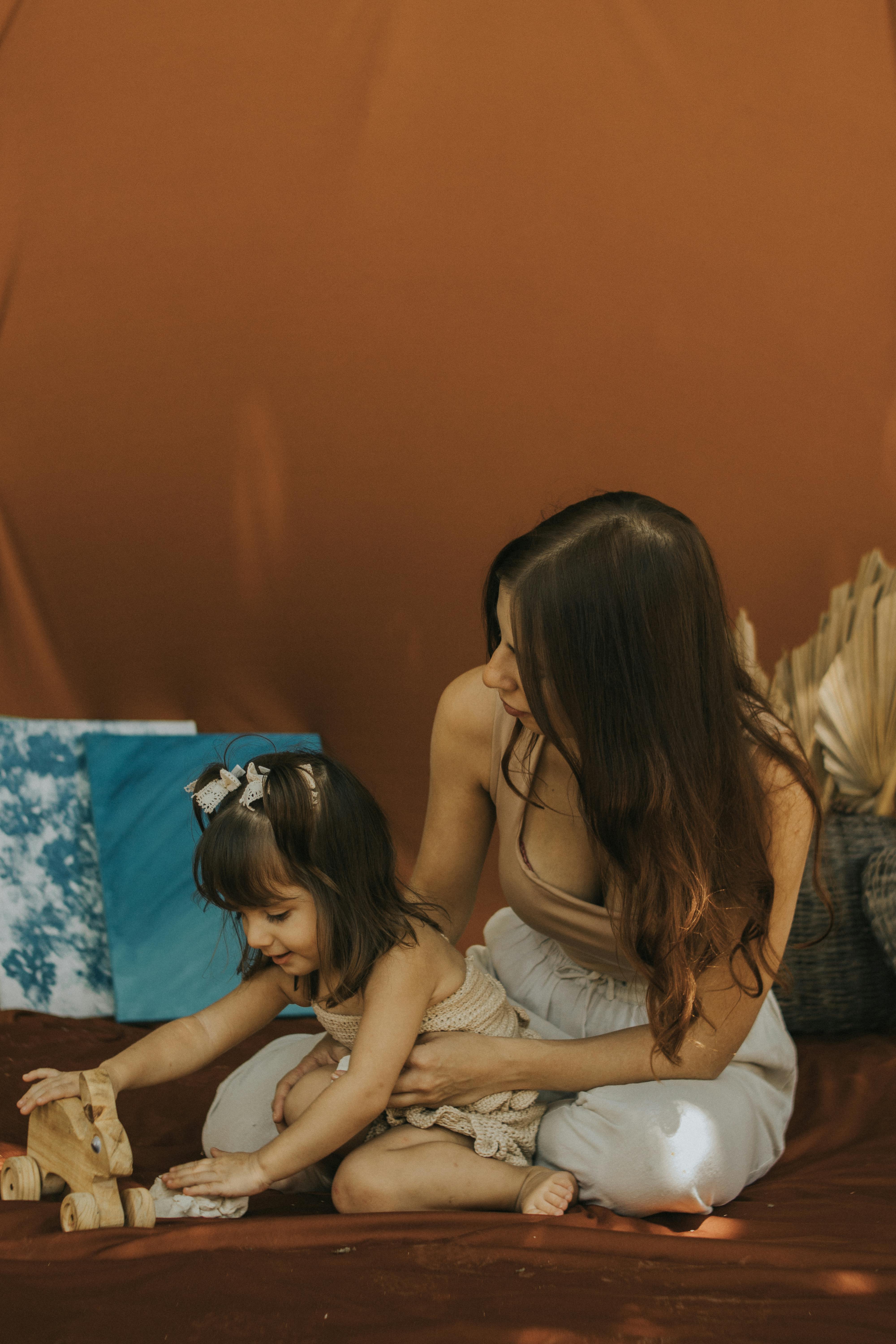 Mother and Daughter Playtime in Cozy Setting · Free Stock Photo