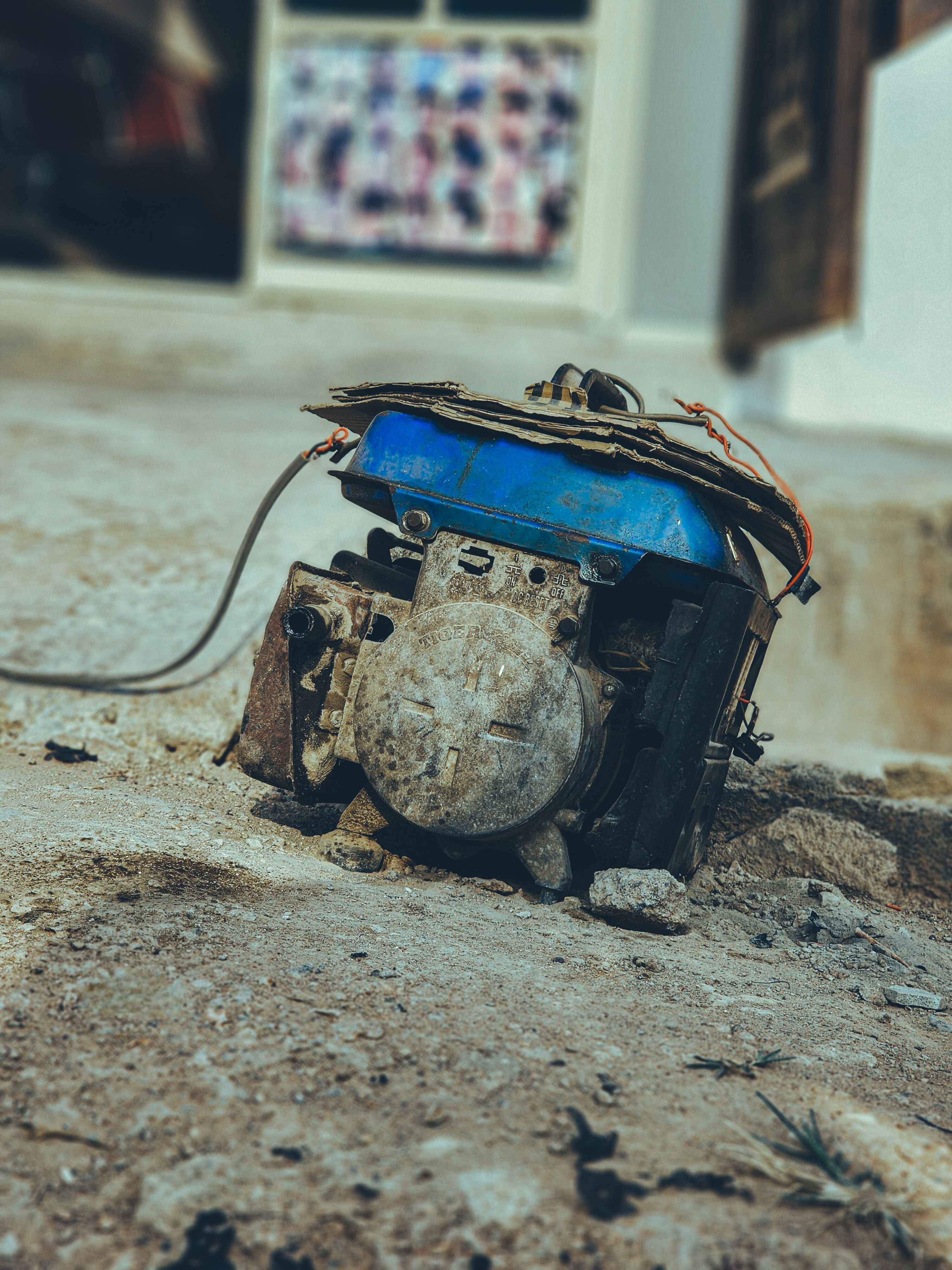 Old Rusty Engine on a Concrete Surface · Free Stock Photo