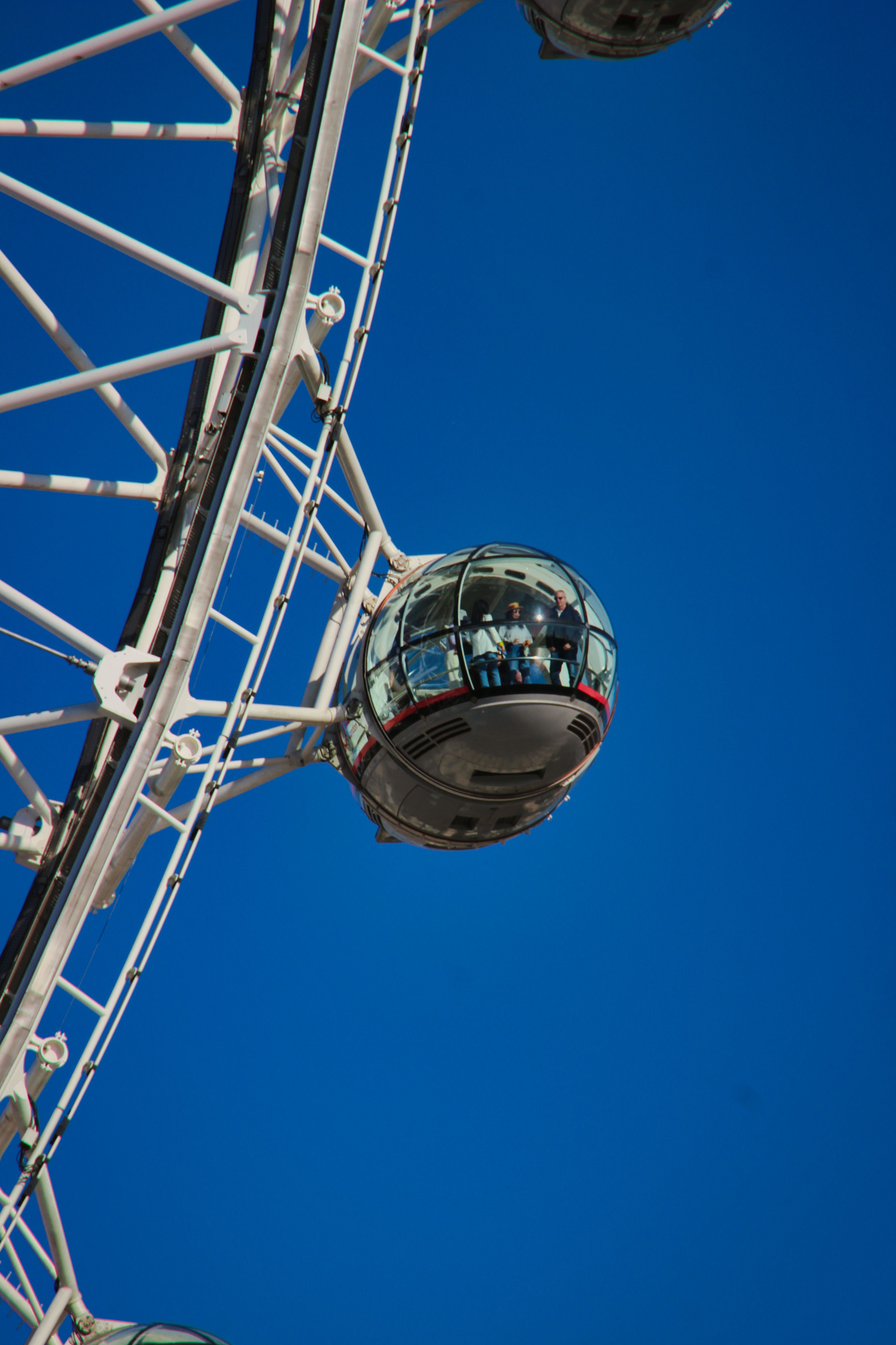 Close-Up of London Eye Capsule Against Blue Sky · Free Stock Photo