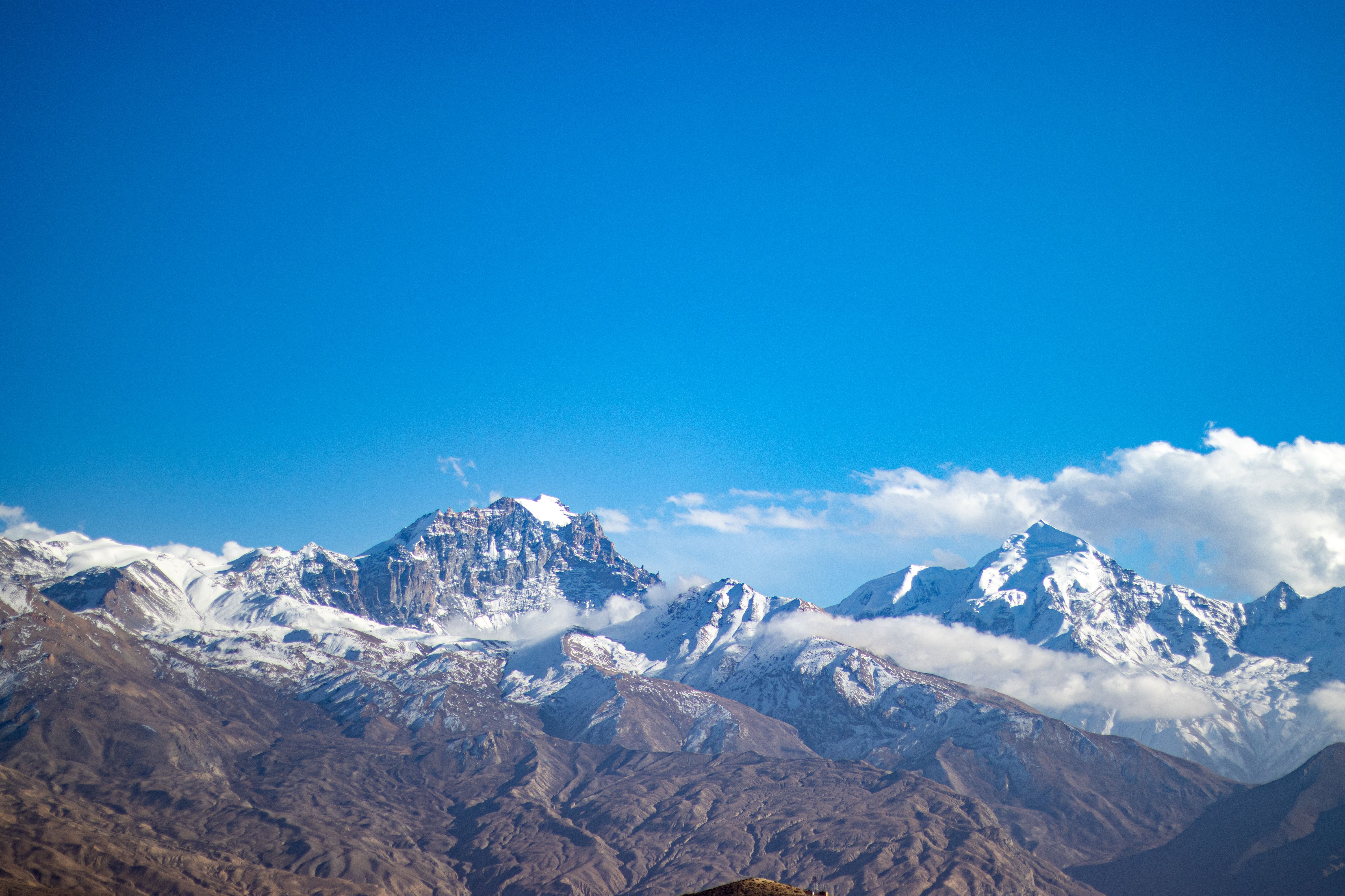 Snow-Capped Himalayan Mountain Range Under Blue Sky · Free Stock Photo