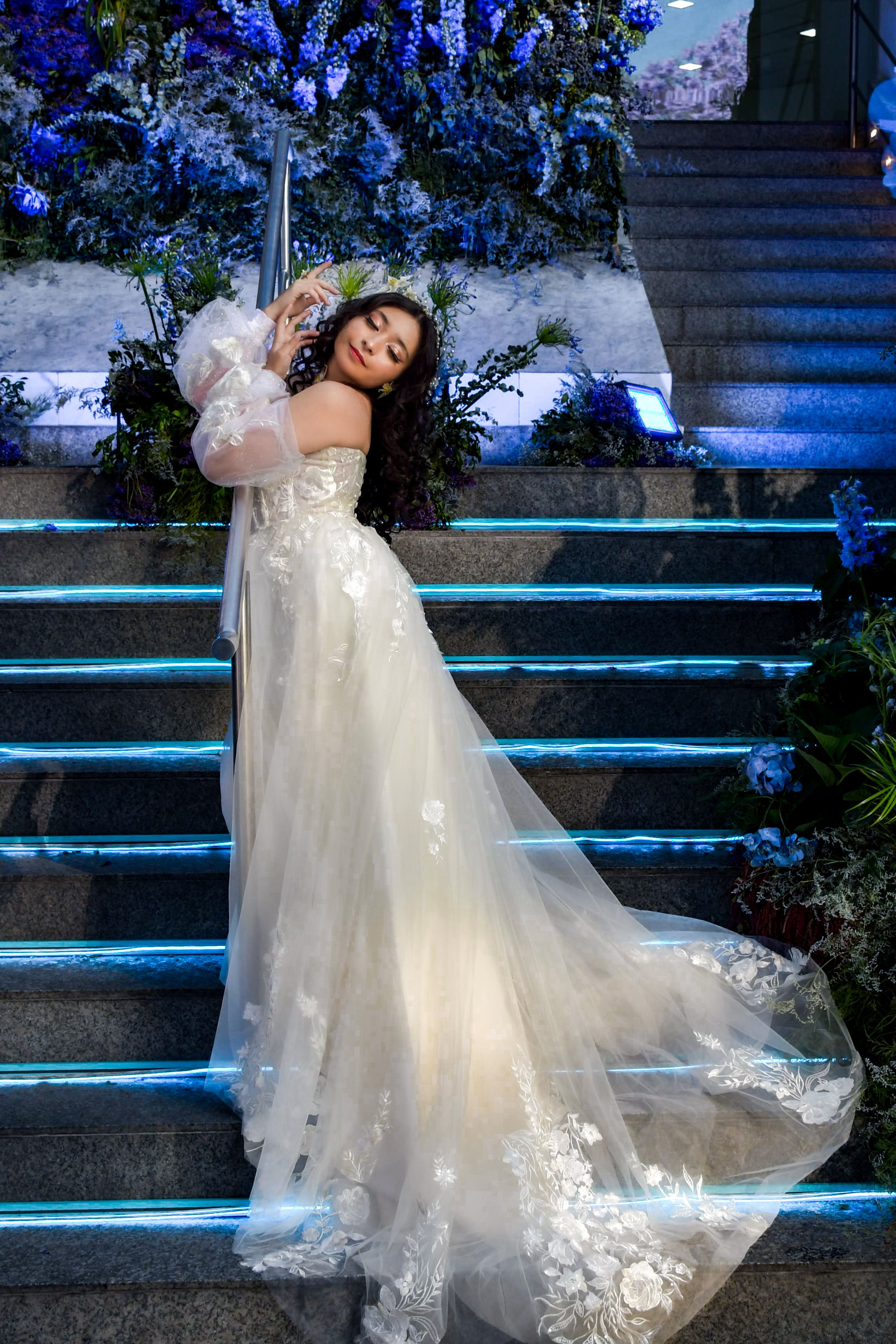Elegant Bride on Illuminated Staircase at Night · Free Stock Photo