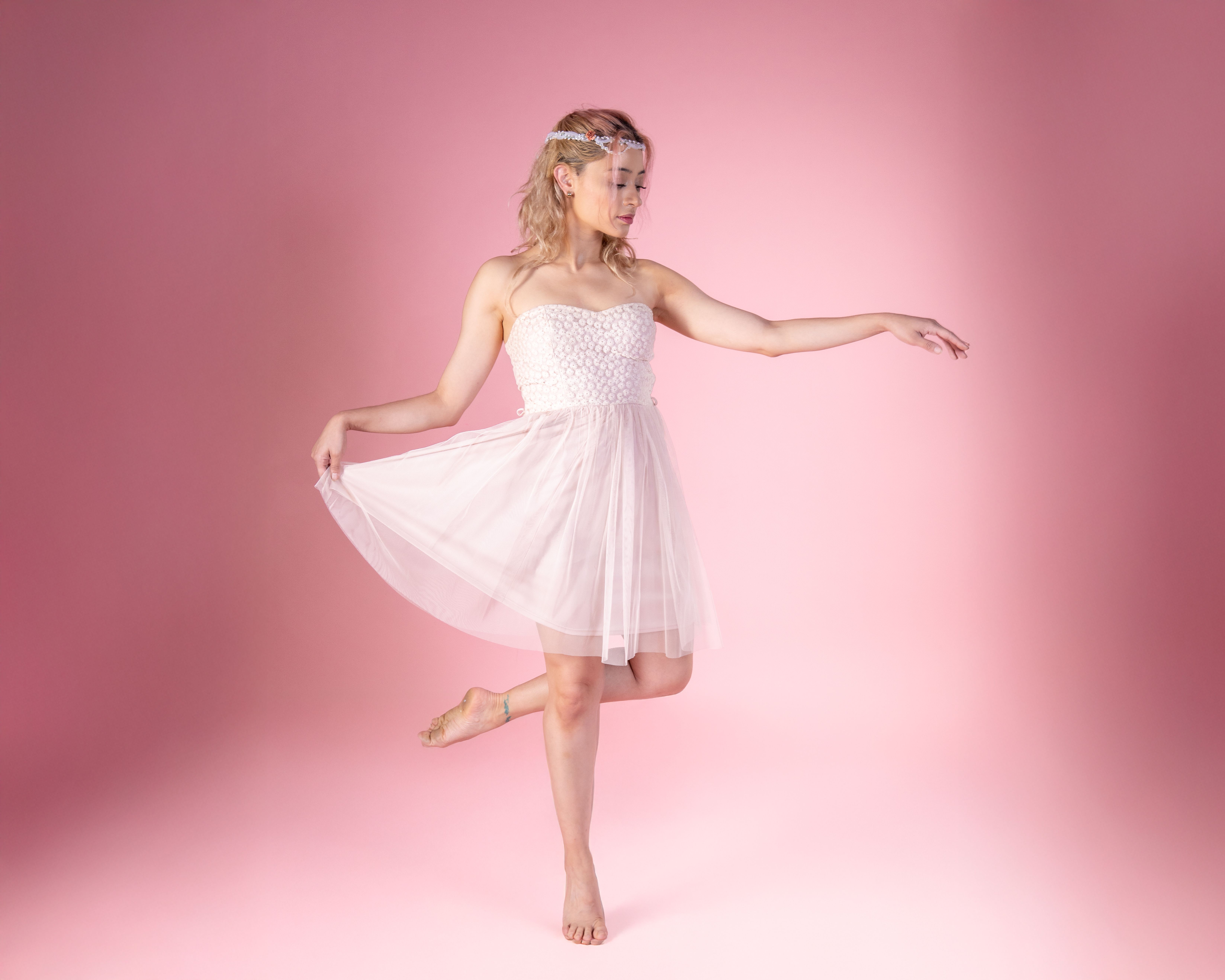 Elegant Ballet Dancer in Pink Dress on Studio Background · Free Stock Photo
