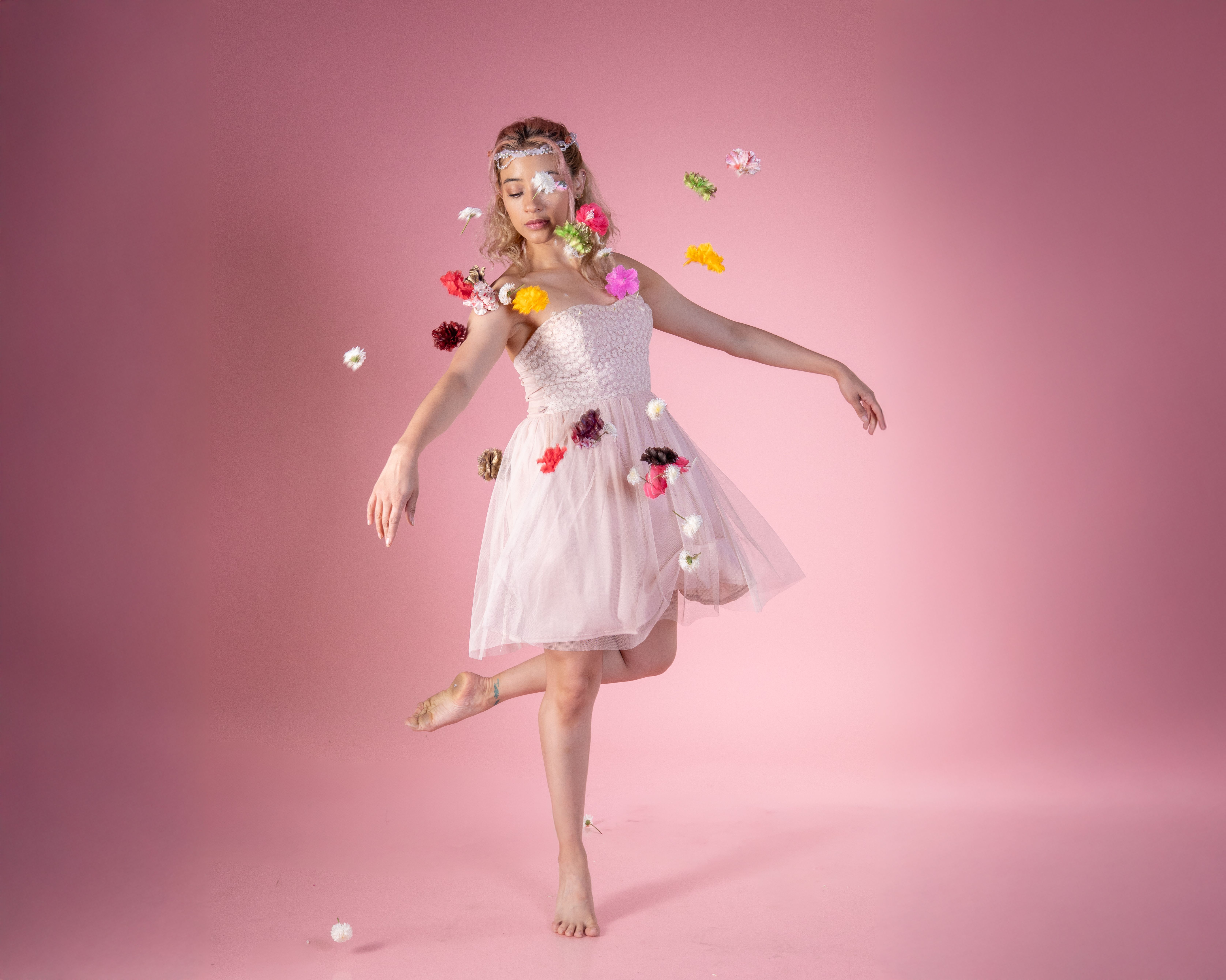 Elegant Ballet Dancer in Motion with Floral Accents · Free Stock Photo