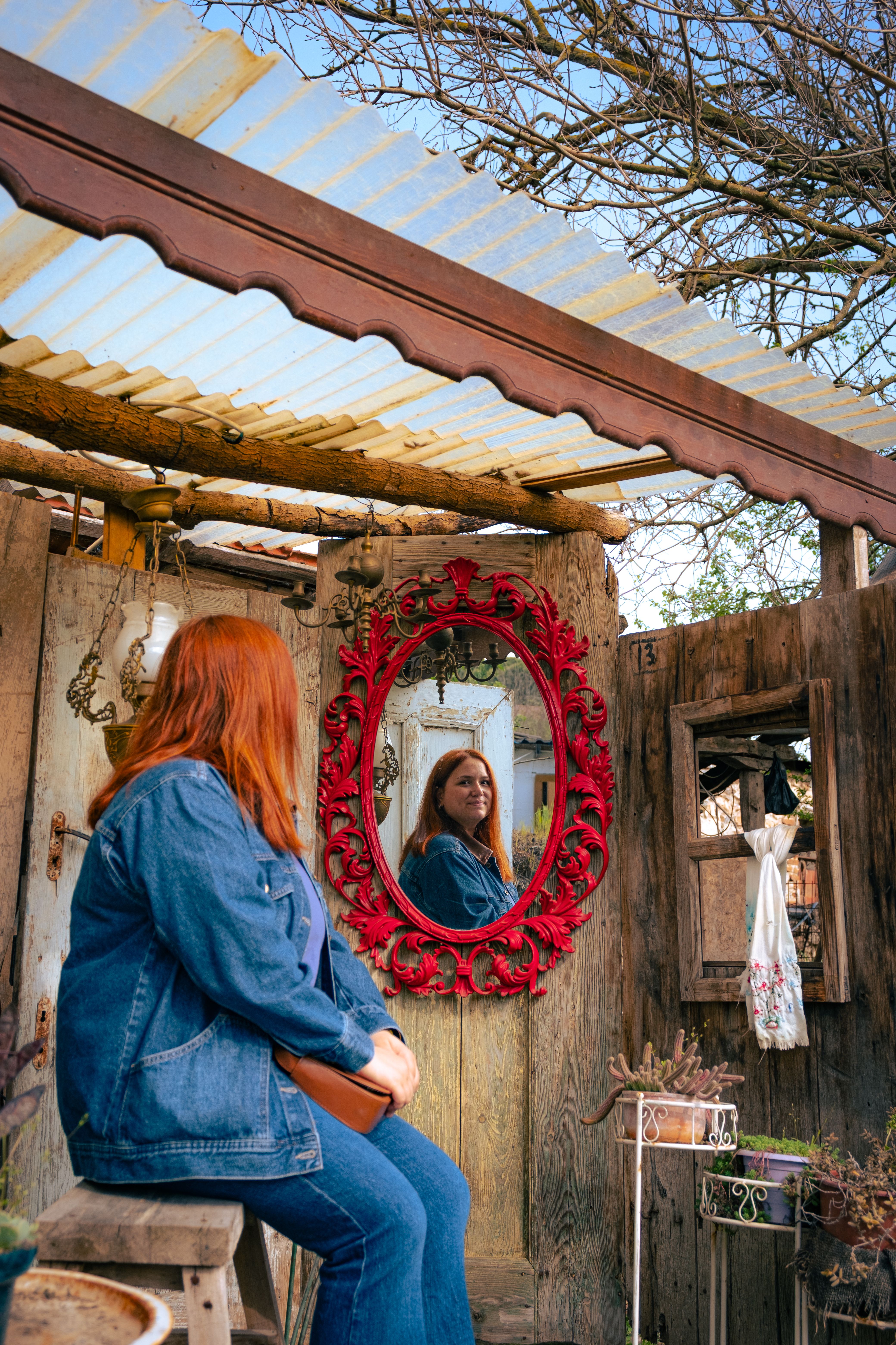 Reflection in a Red Ornate Mirror Outdoors · Free Stock Photo