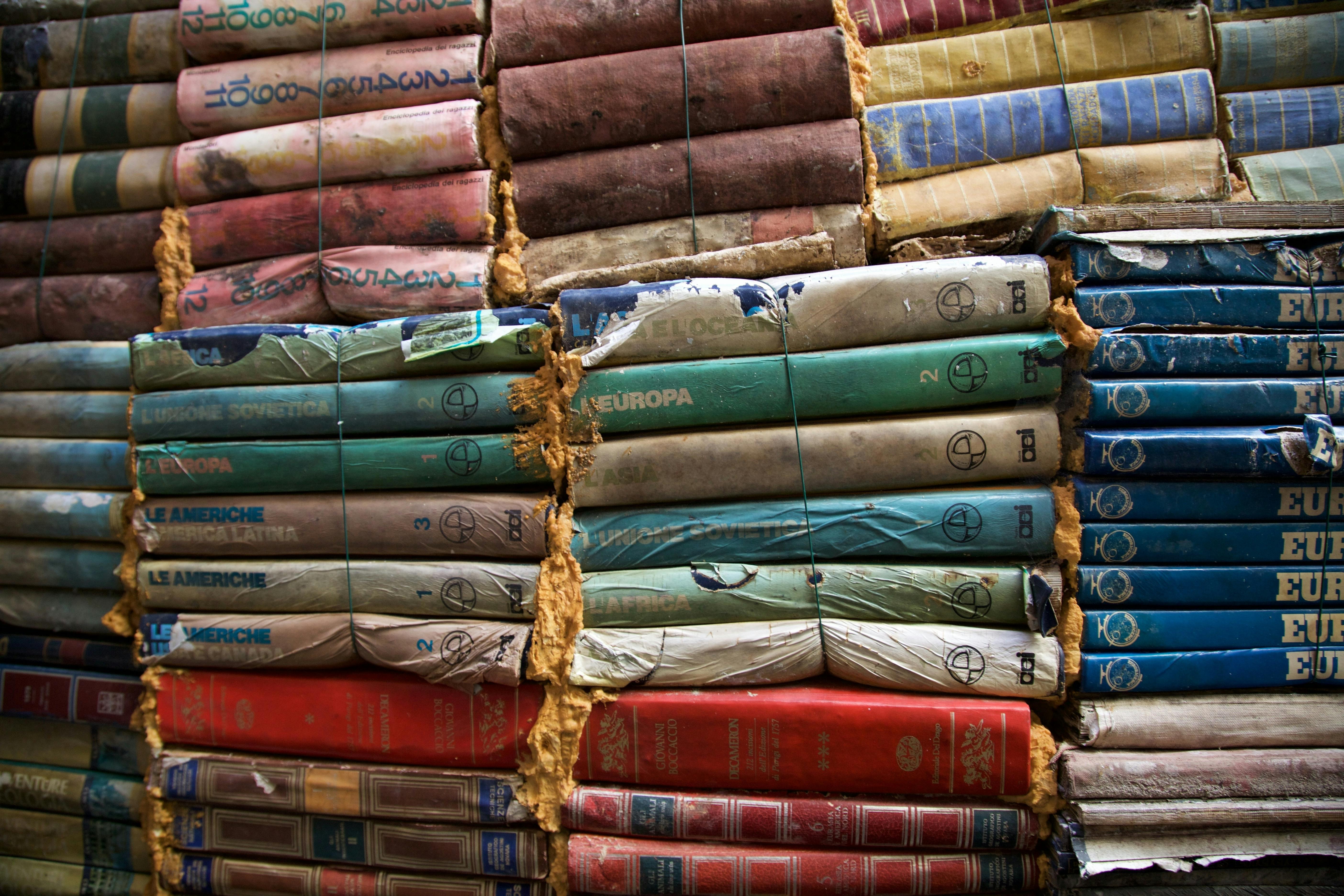 Stack of Old Books with Worn Covers · Free Stock Photo