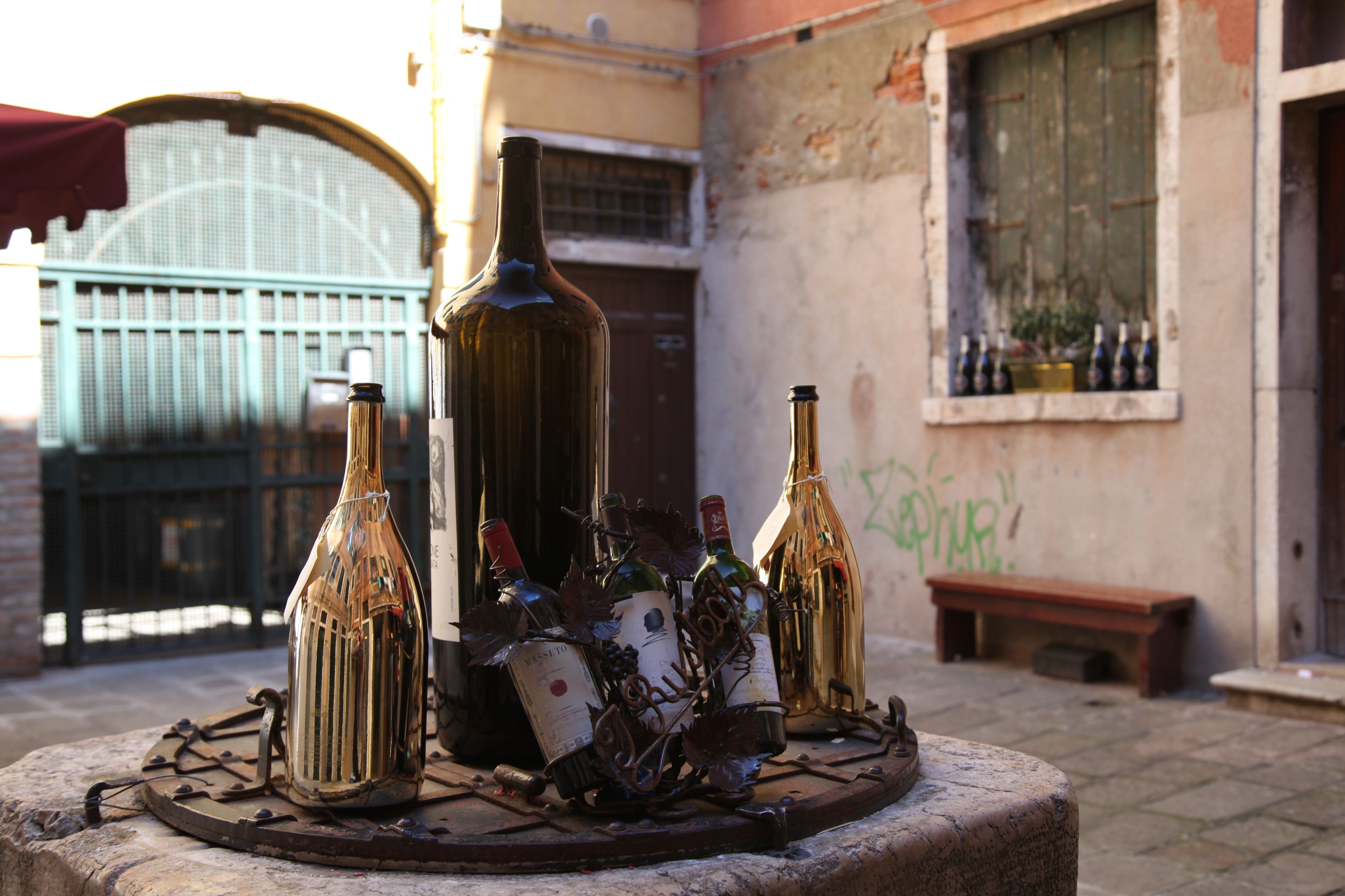Rustic Italian Courtyard with Wine Display · Free Stock Photo