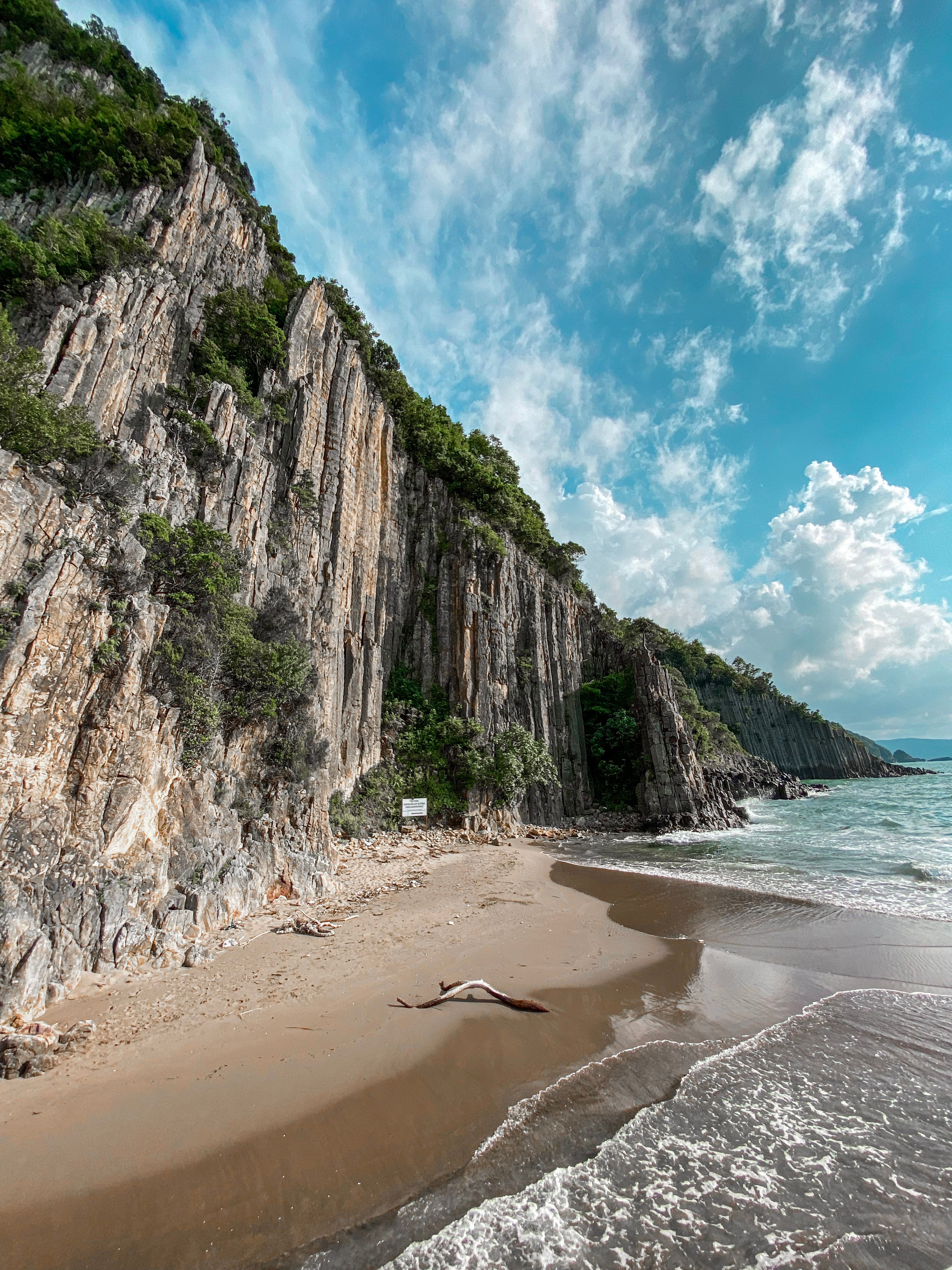 Dramatic Cliff and Sea View with Sandy Beach · Free Stock Photo