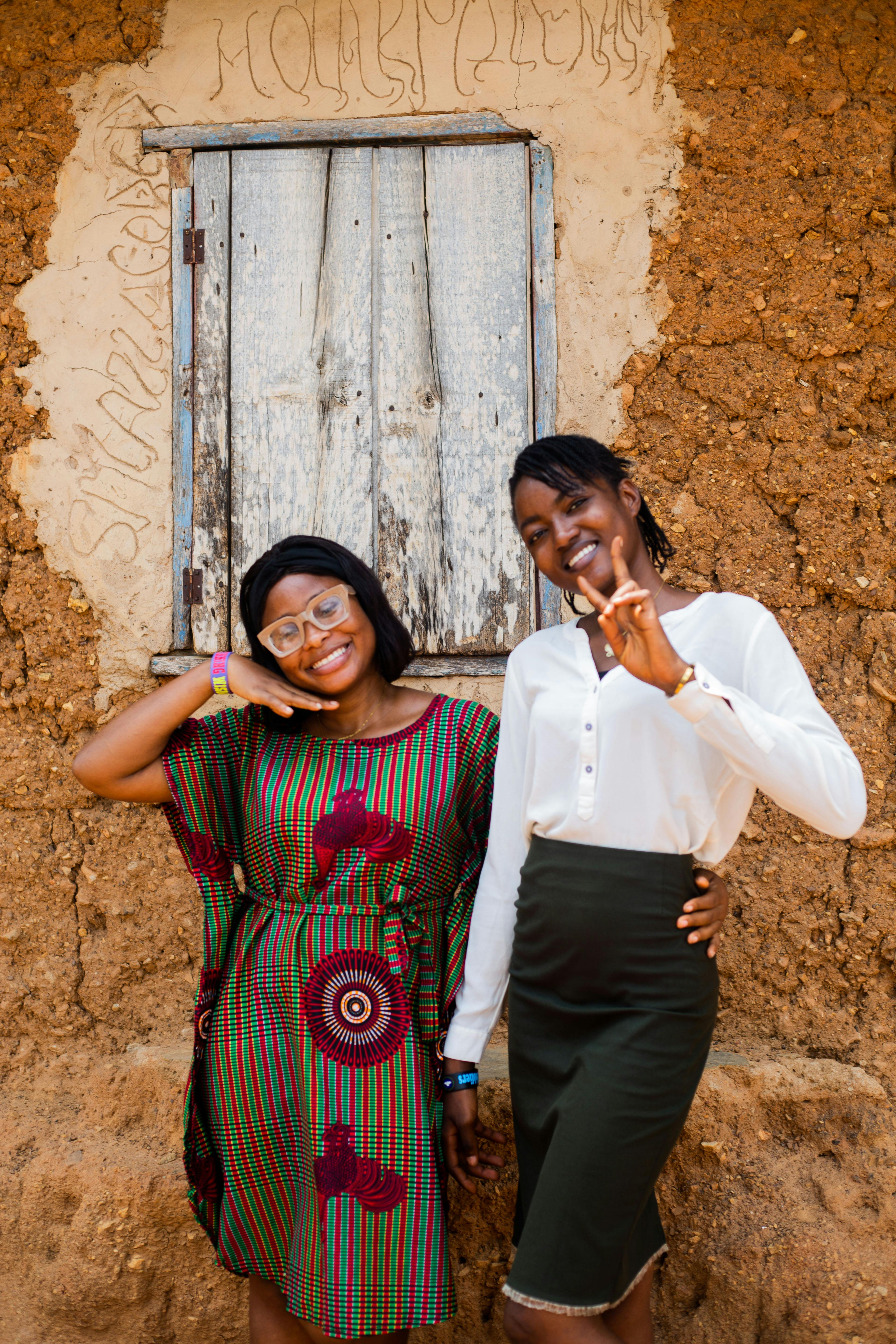Joyful Portrait of Two Women in African Attire · Free Stock Photo