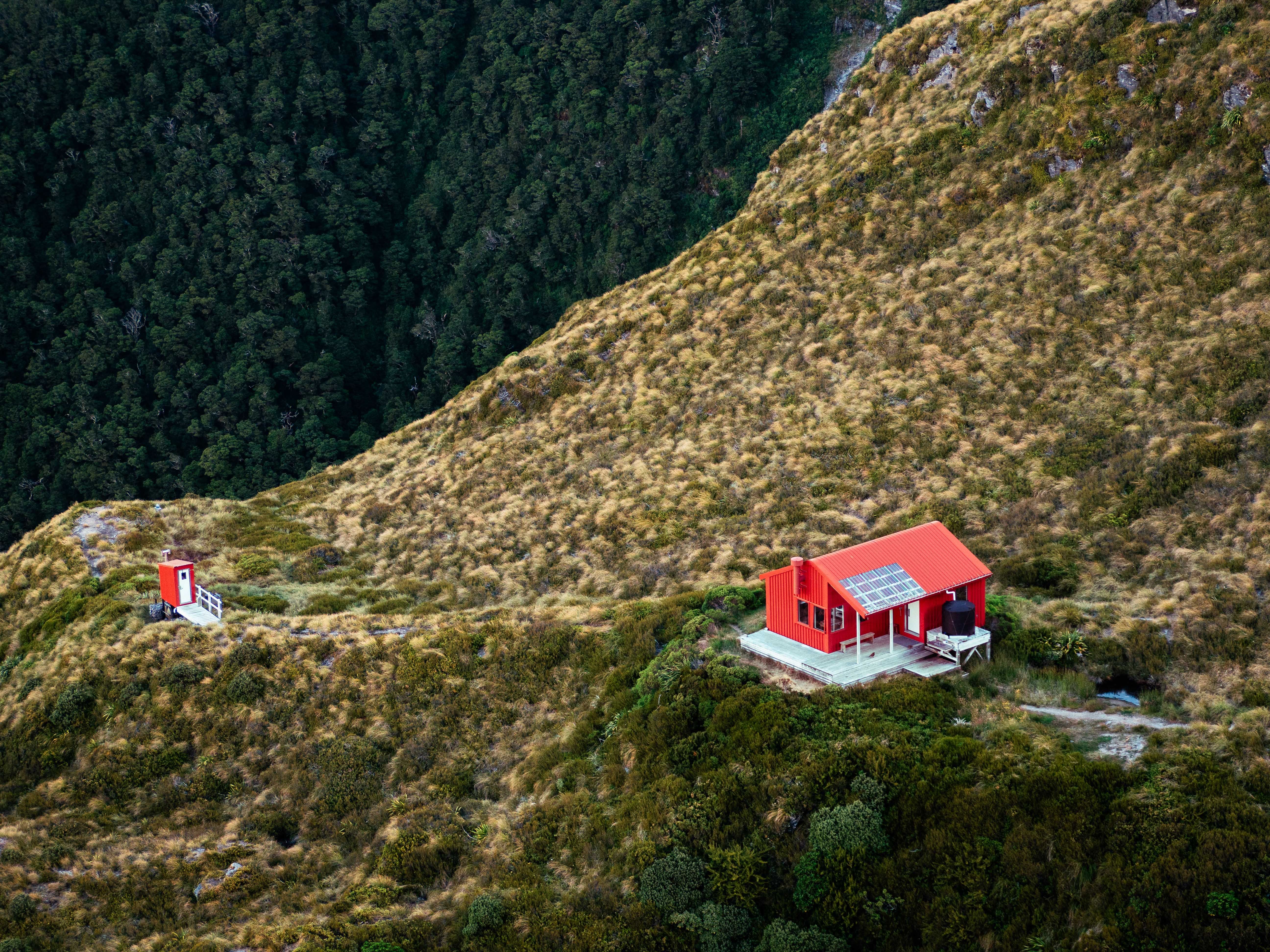 Remote Red Cabin in Mountainous Terrain · Free Stock Photo