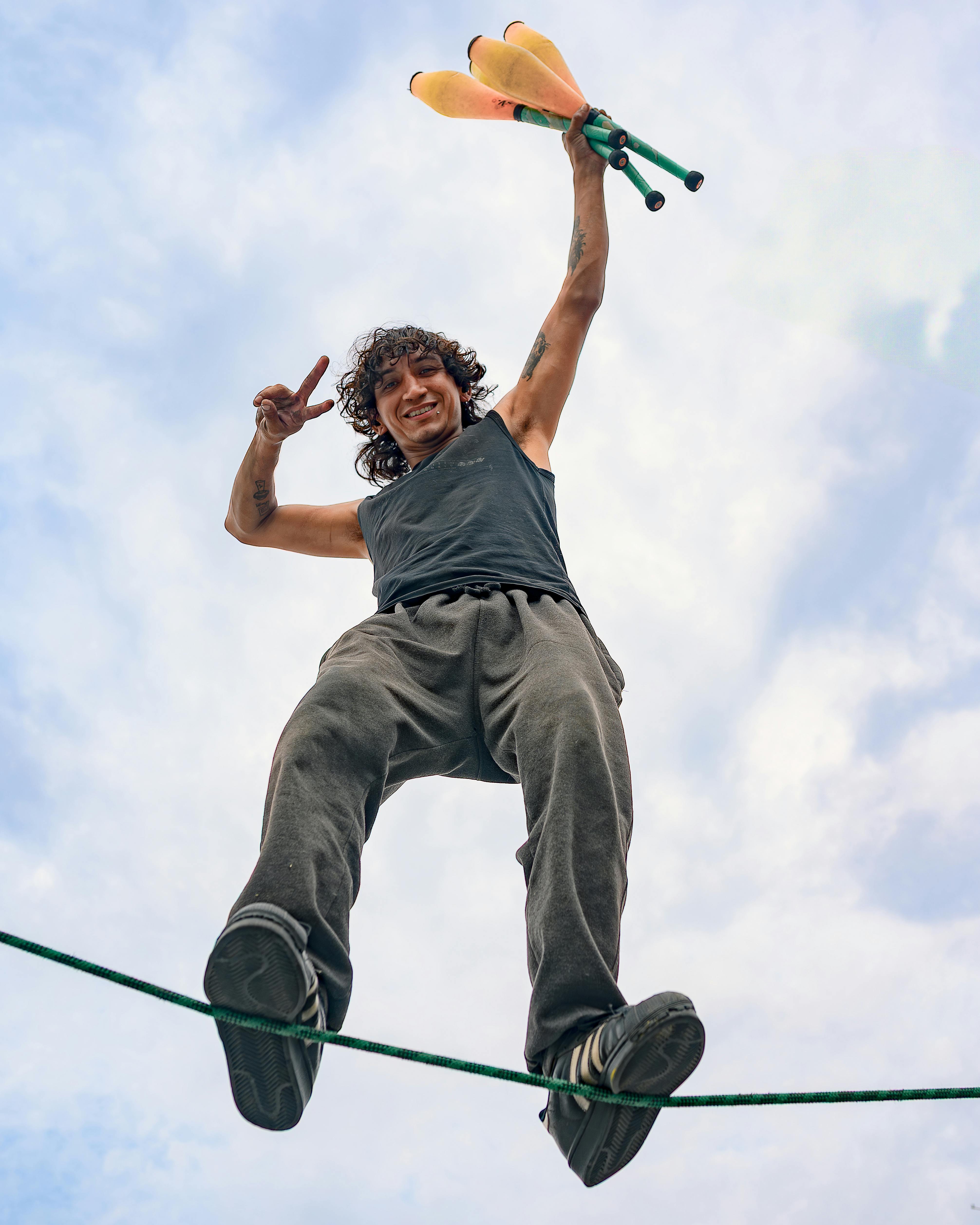 Dynamic Slackliner Performing Aerial Juggling Skills · Free Stock Photo