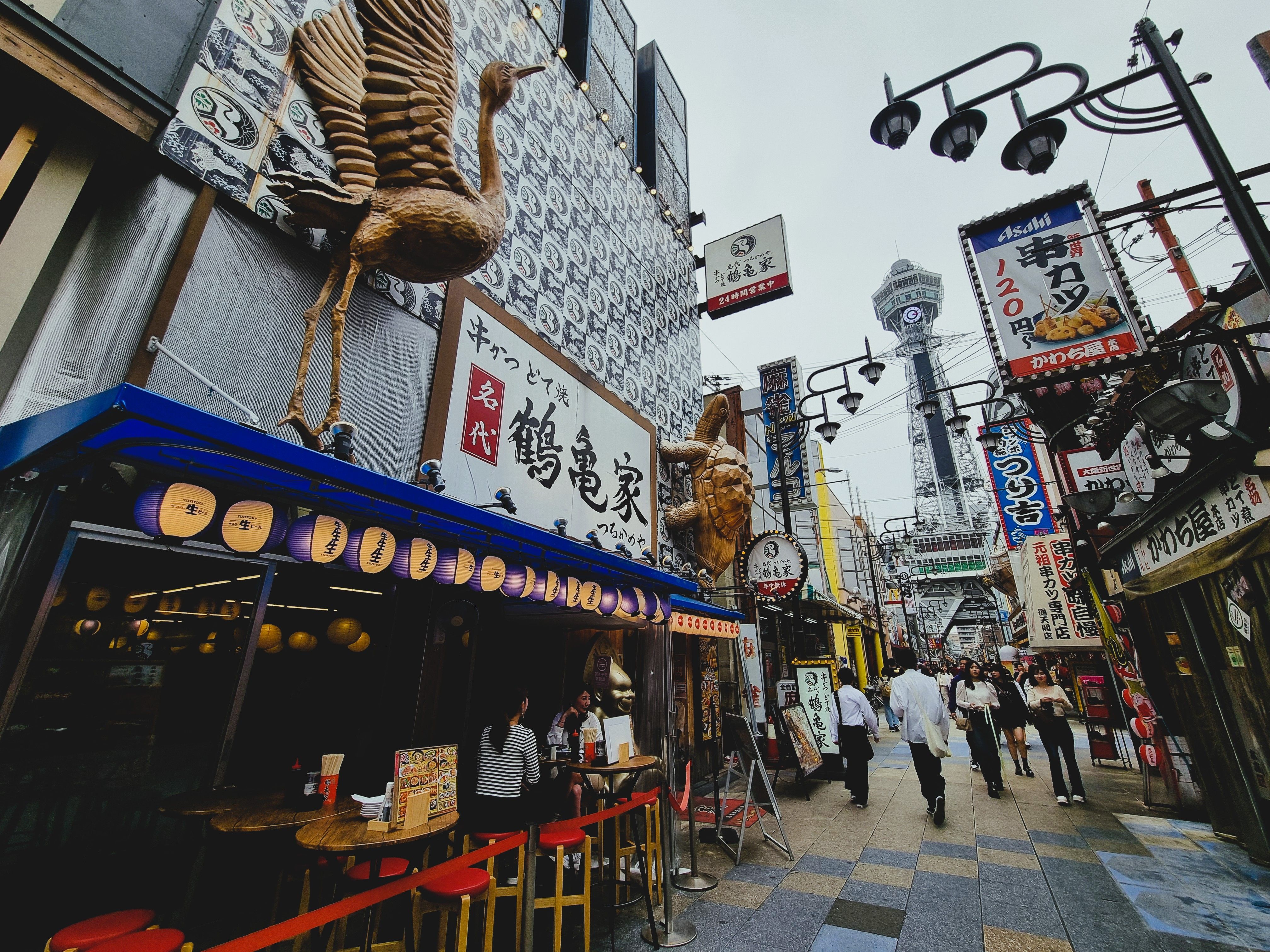 Vibrant Street Scene in Osaka's Shinsekai District · Free Stock Photo