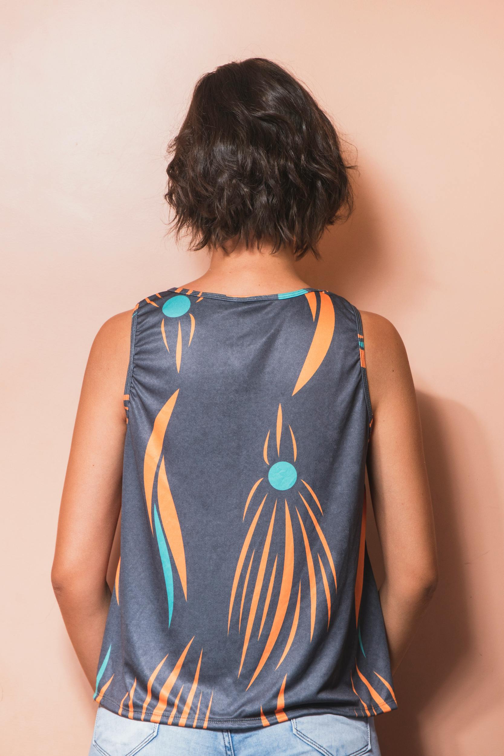 Back View of Woman in Colorful Graphic Top · Free Stock Photo