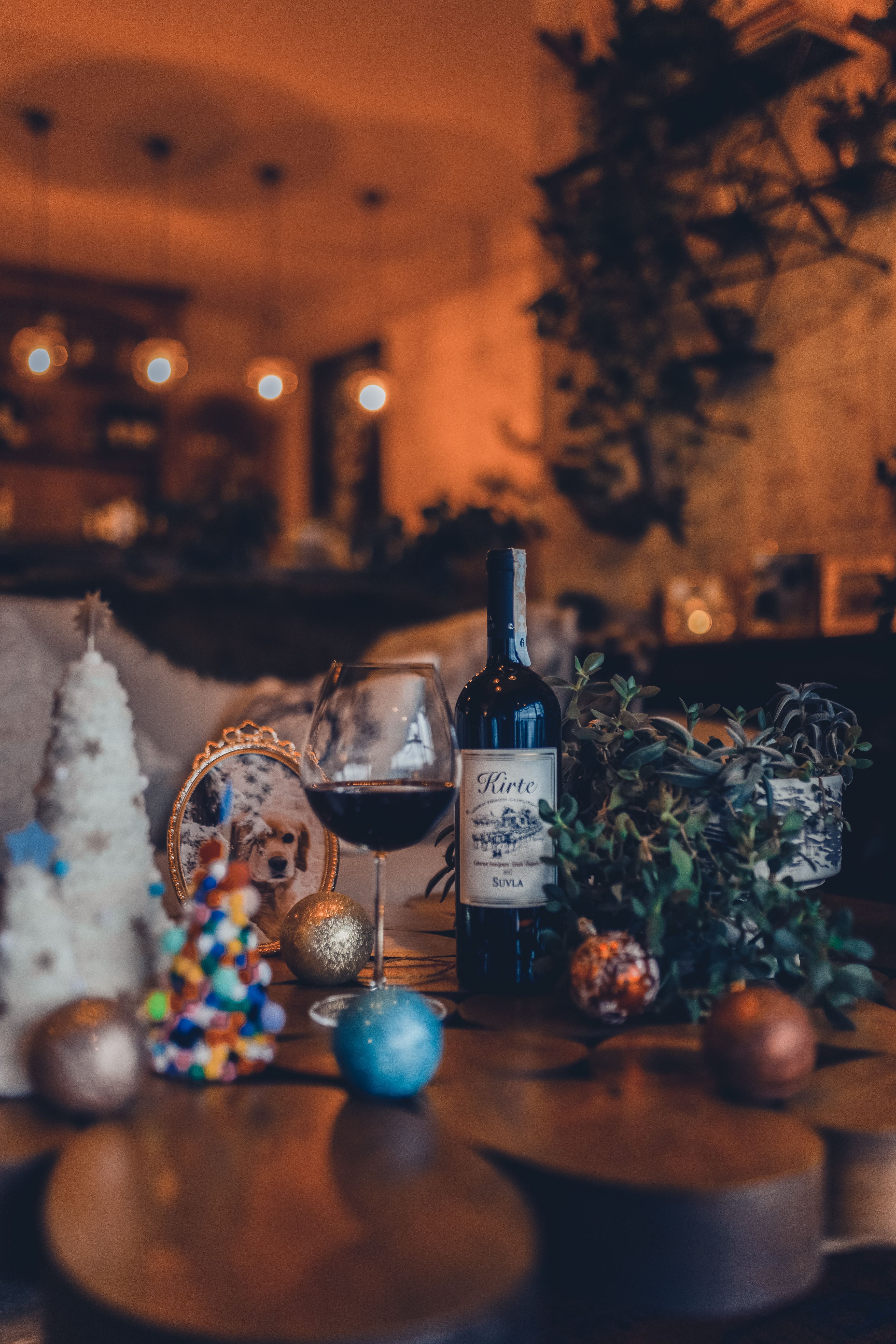Cozy Holiday Wine Setup with Festive Decor · Free Stock Photo