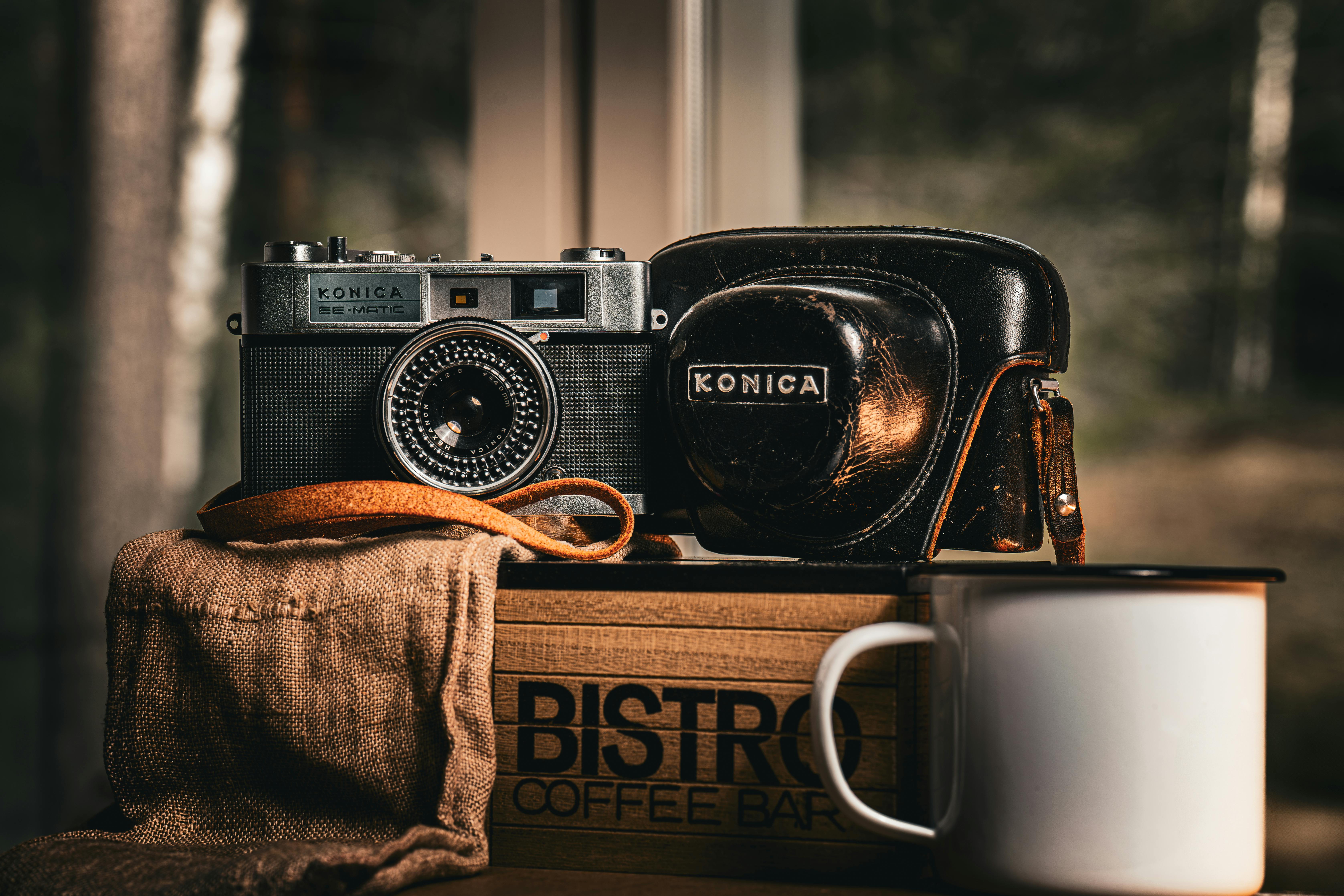 Vintage Konica Camera with Leather Case Display · Free Stock Photo