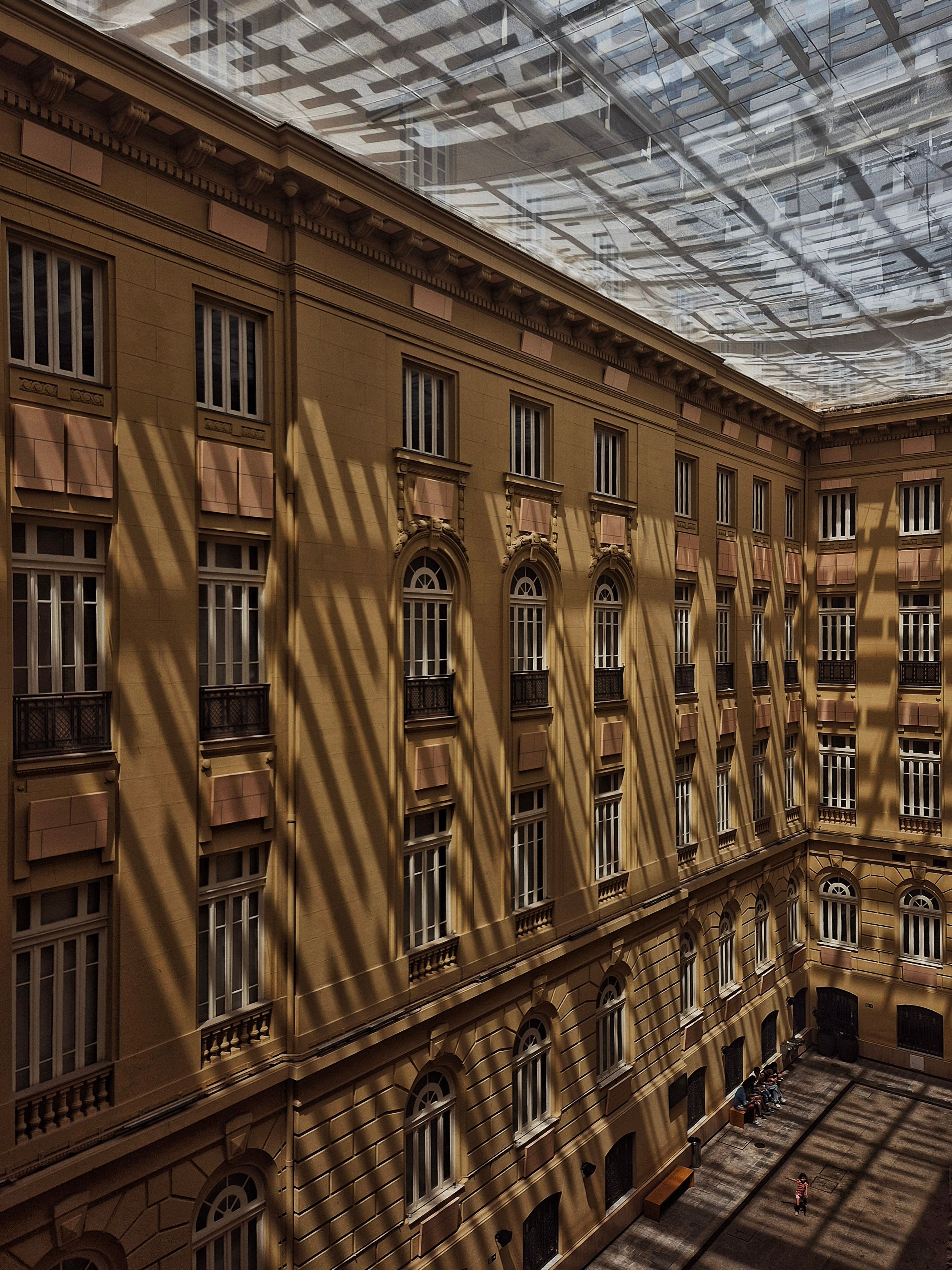 Architectural Shadows in Historic Indoor Courtyard · Free Stock Photo