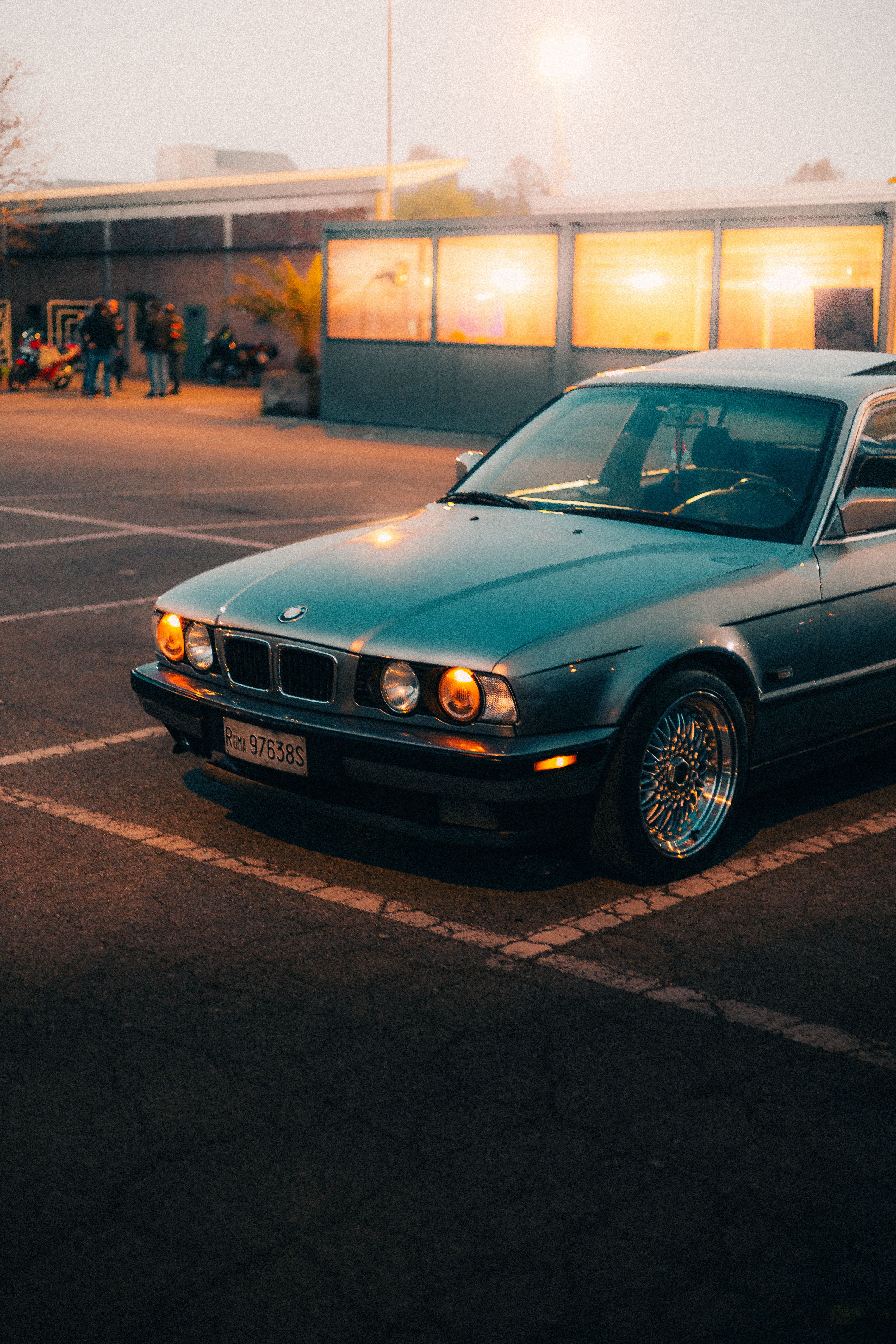 Classic Car in Evening Parking Lot Scene · Free Stock Photo