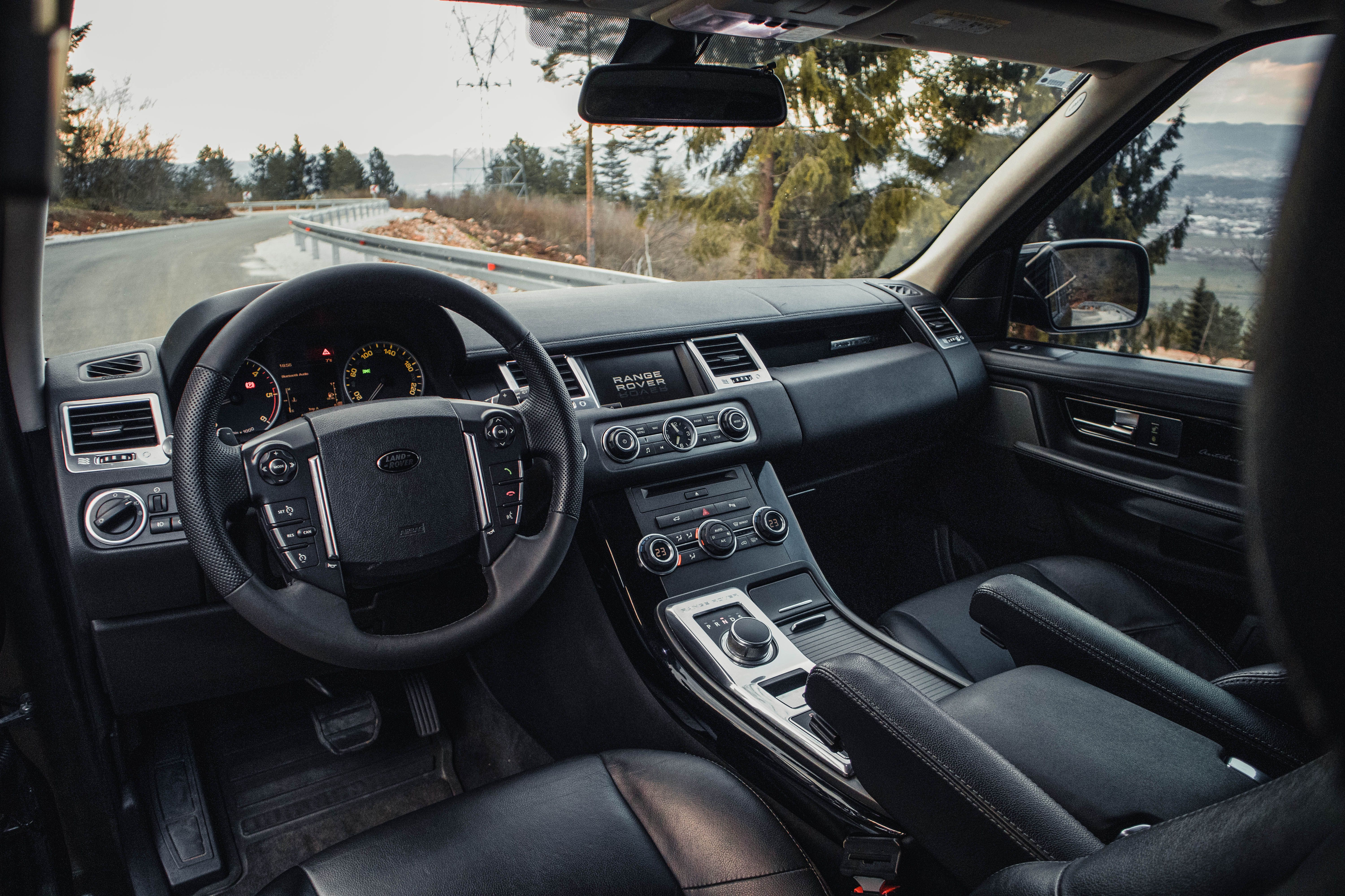 Elegant Range Rover Interior on Mountain Road · Free Stock Photo