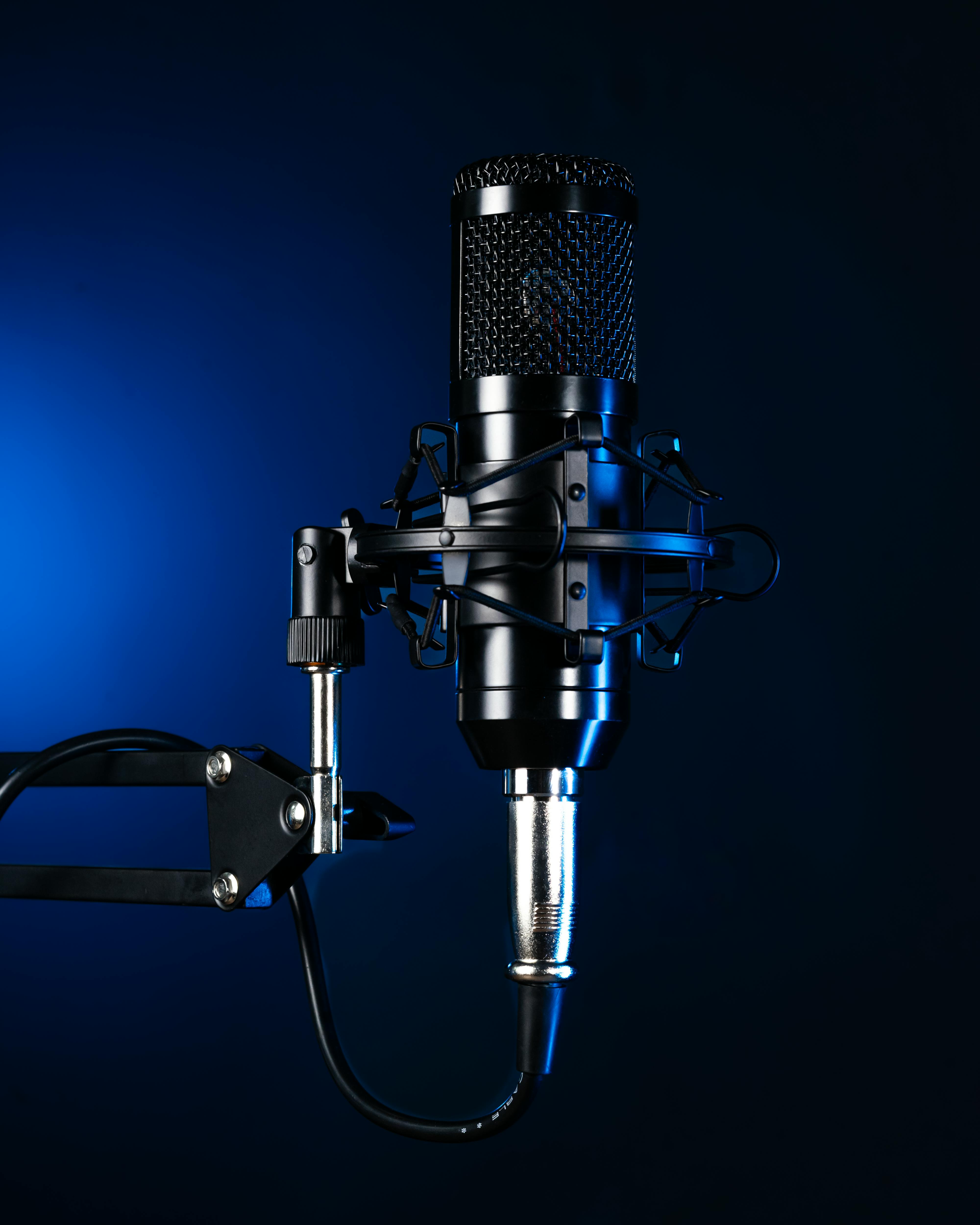 Silver Dynamic Microphone on Black Microphone Stand · Free Stock Photo