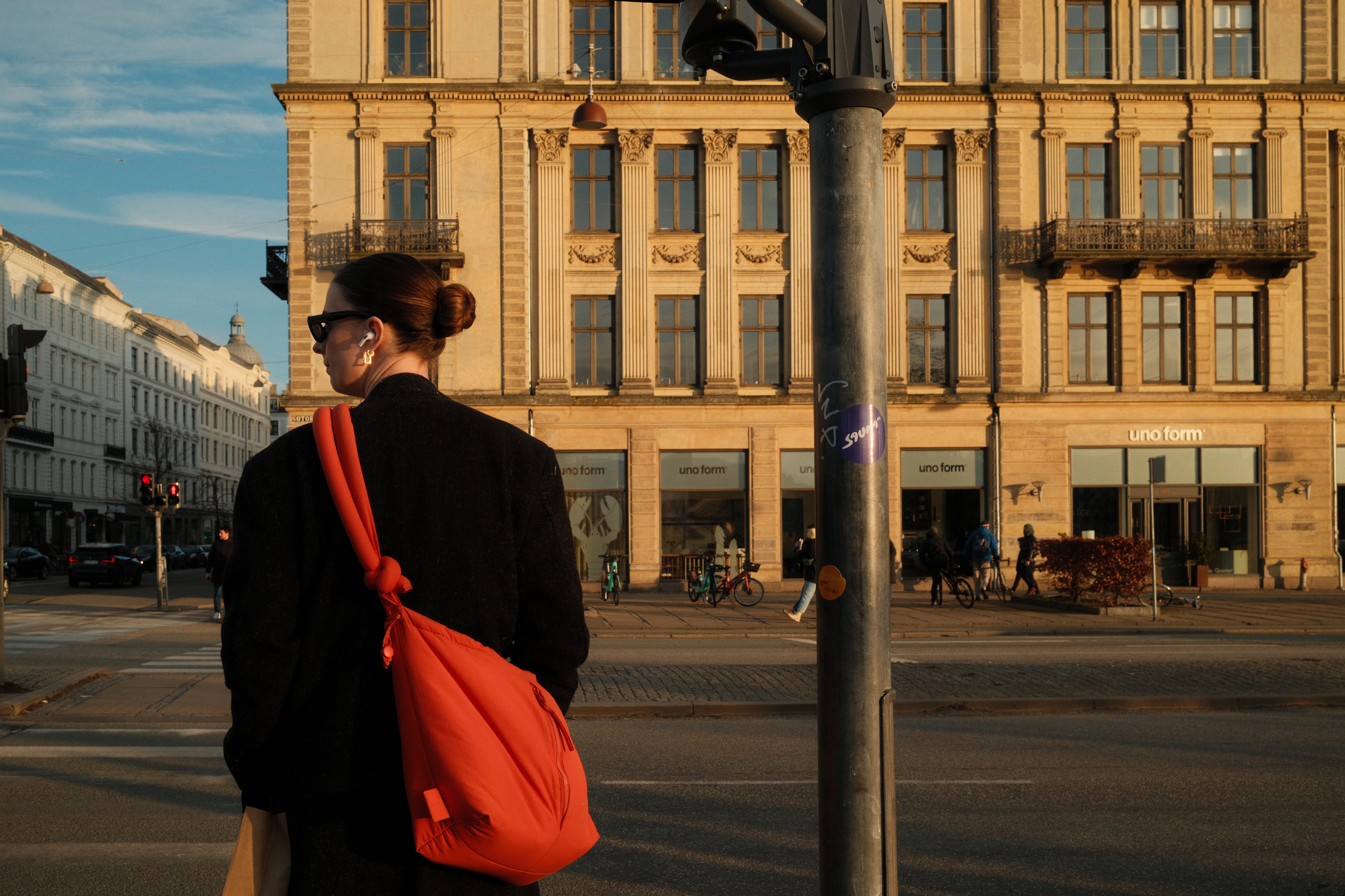 Street View of Person with Red Bag in Urban Setting · Free Stock Photo